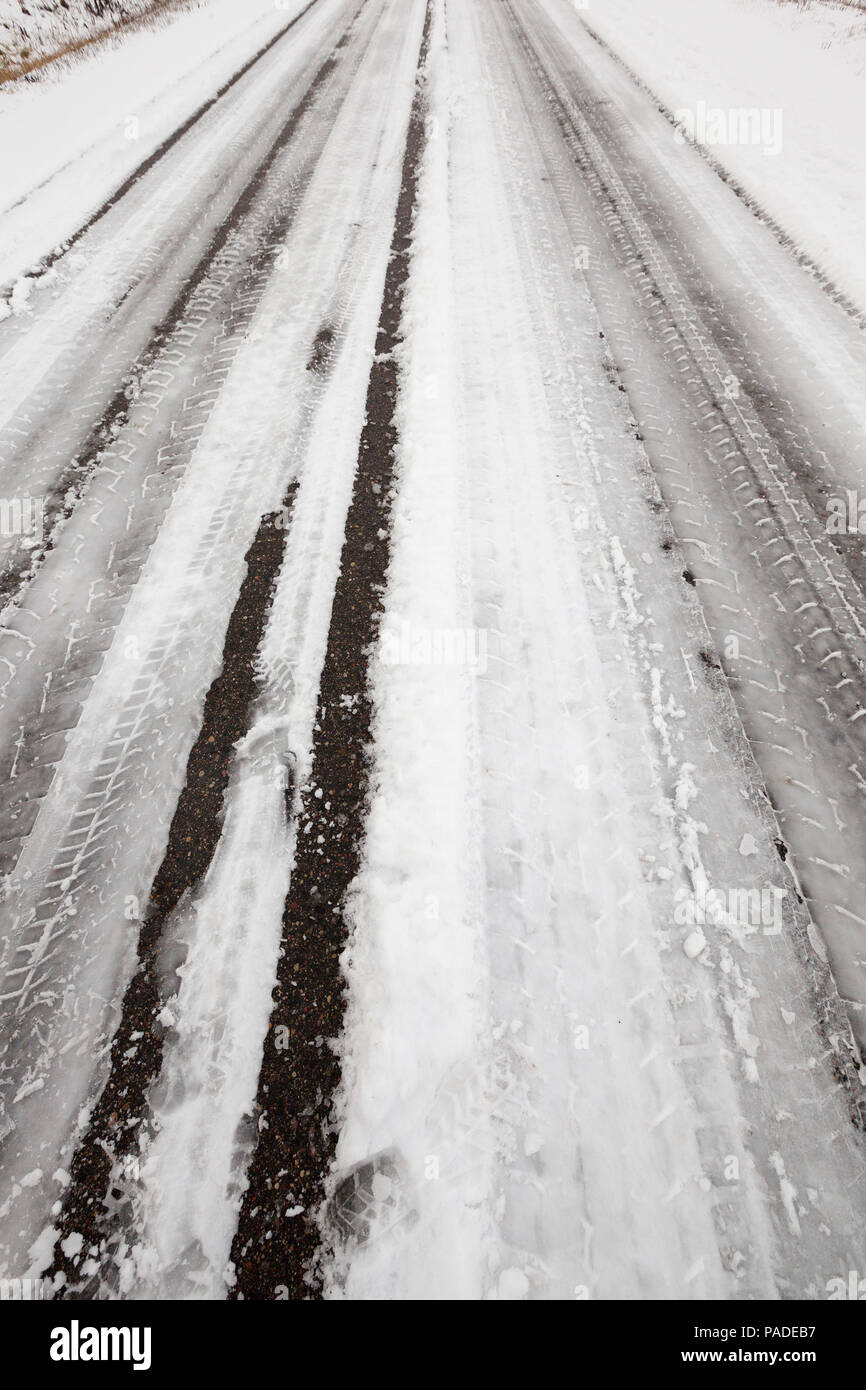 snow-covered road in the winter season, Close-up photo Stock Photo - Alamy