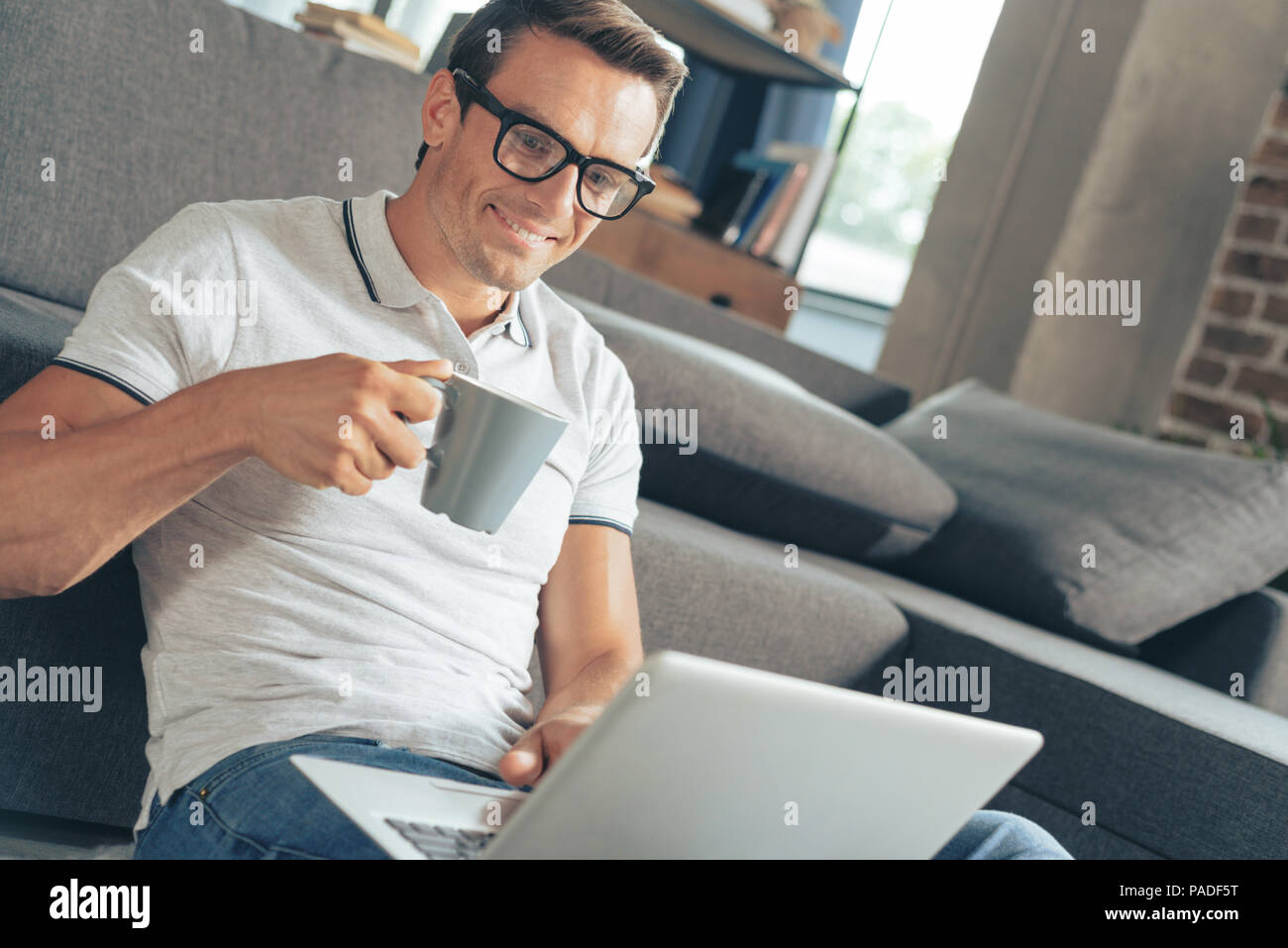 Enjoying online entertainment home hi-res stock photography and images ...