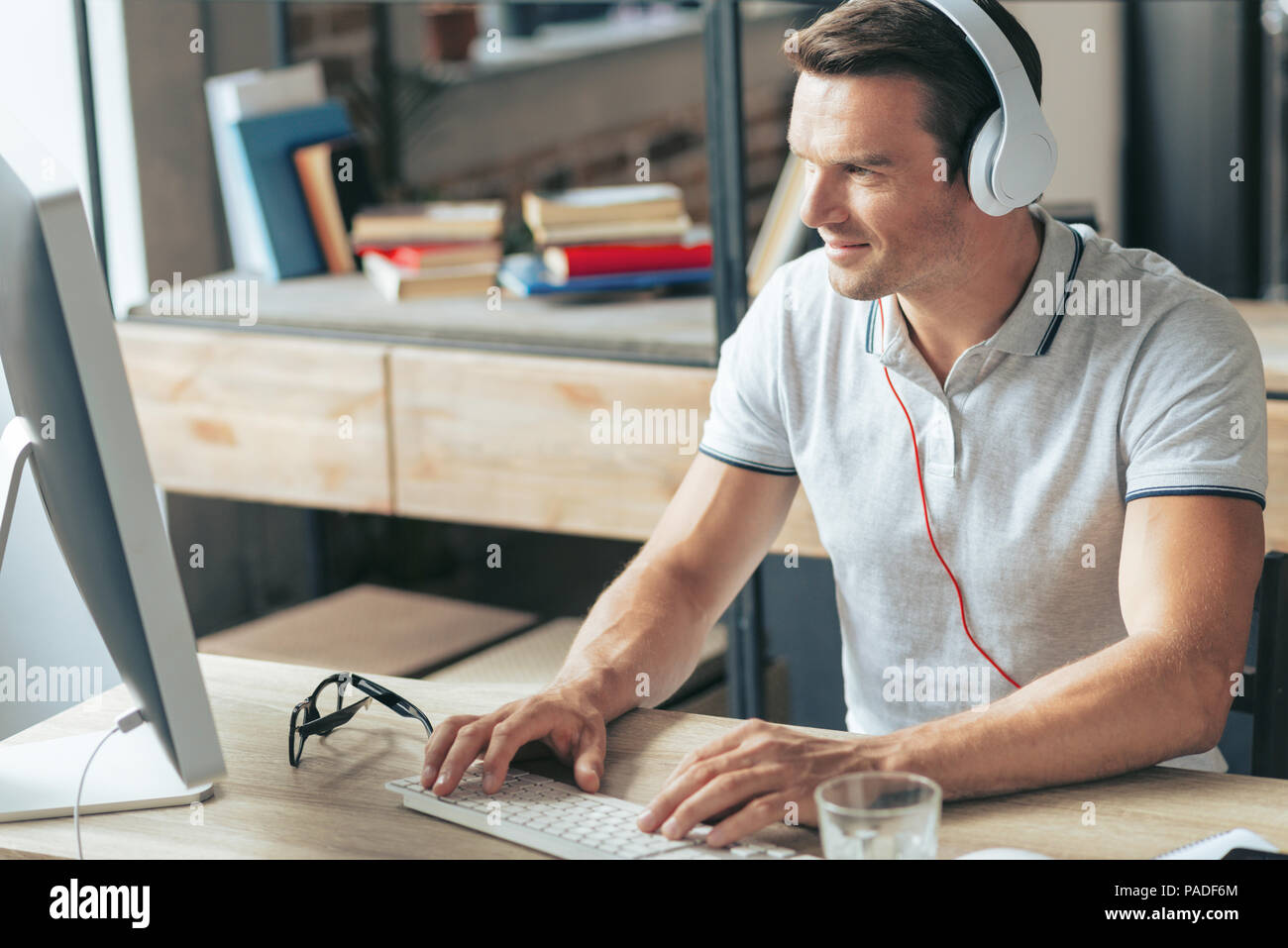 Smart nice man typing on the keyboard Stock Photo - Alamy