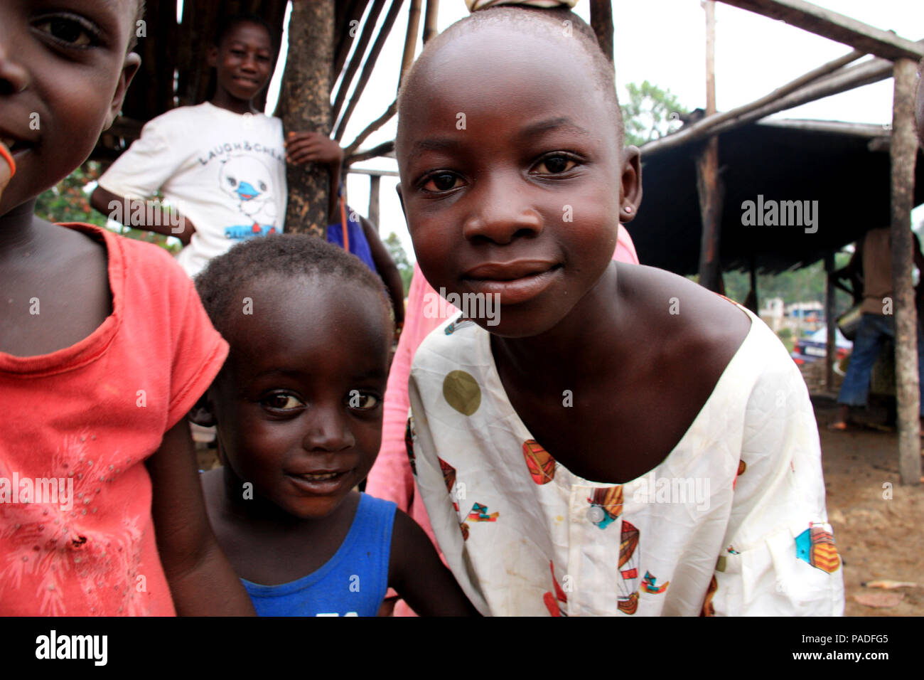 View of curious African kids gathering around and looking at the camera ...