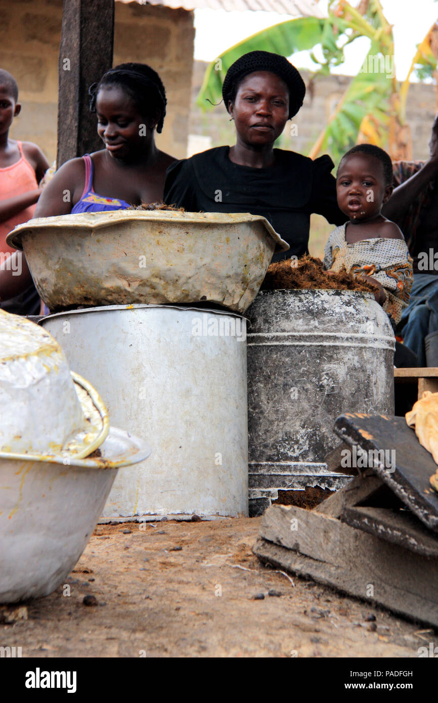African woman and her baby at a palm oil factory near Cape Coast, Ghana ...