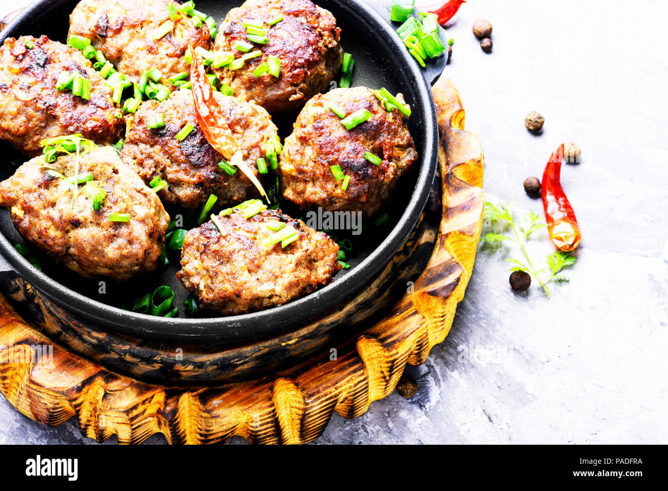 Roasted beef meatballs in cast-iron skillet.Delicious cutlet Stock ...