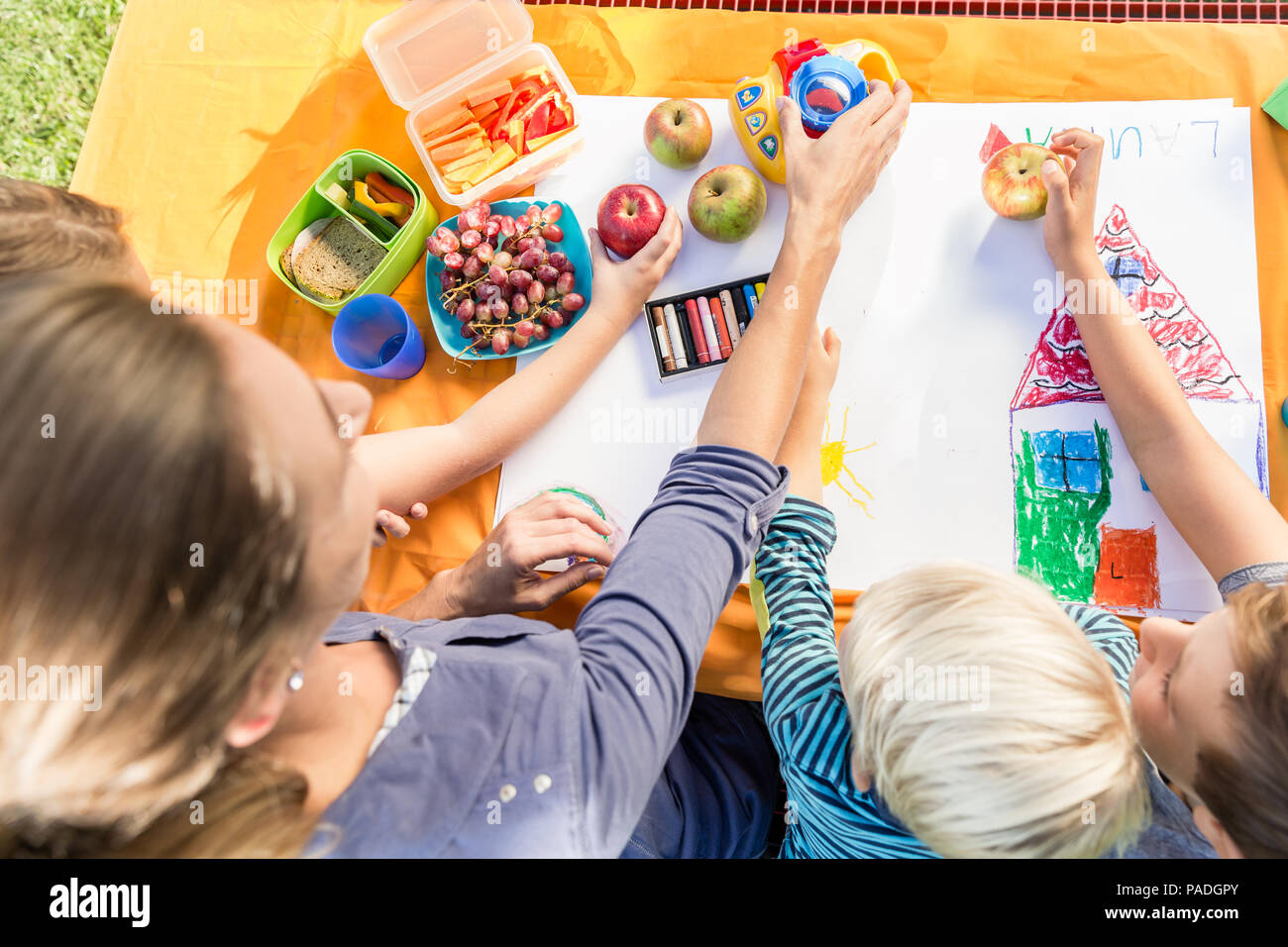 Schoolgirls and schoolboys painting during lunch break Stock Photo - Alamy