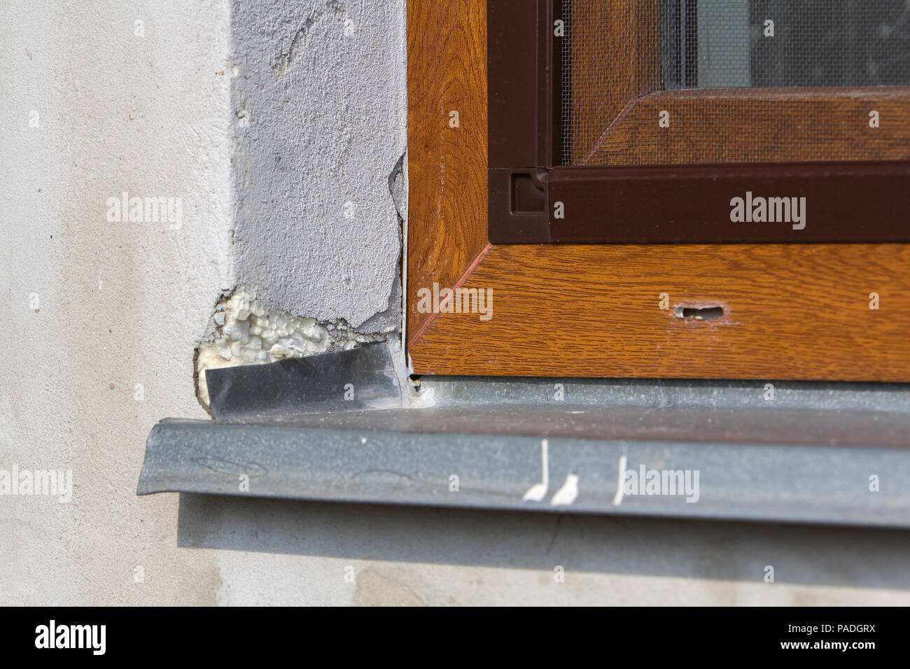Close-up corner detail of white plastered house wall with installed new ...