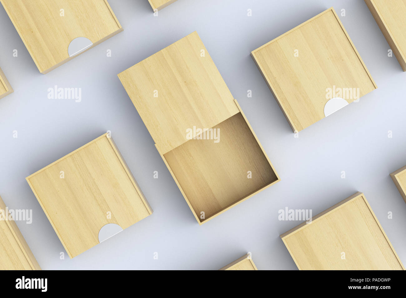 Empty light wooden square box with opened sliding lid with closed boxes ...