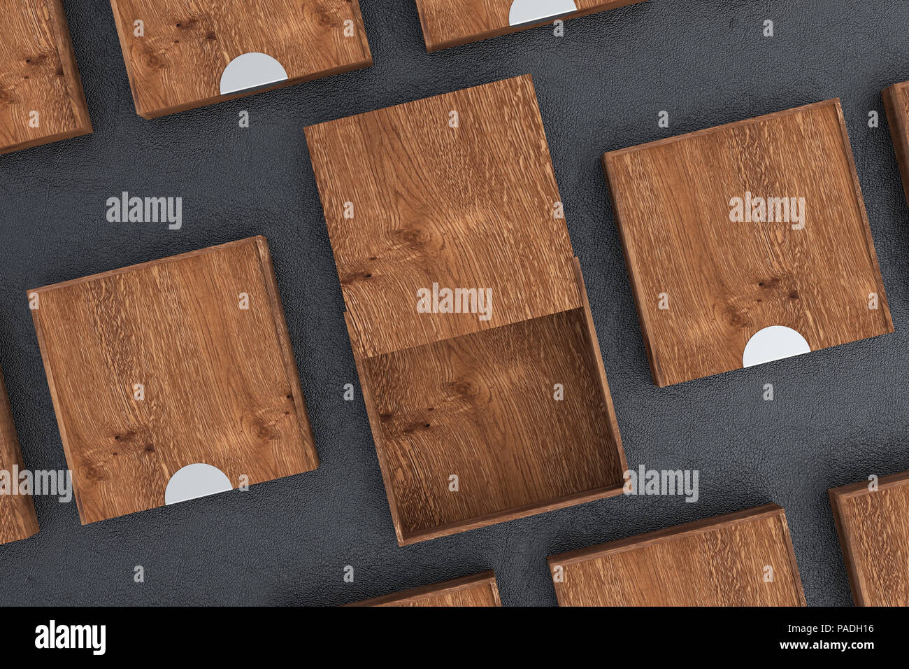 Empty dark wooden square box with opened sliding lid with closed boxes ...