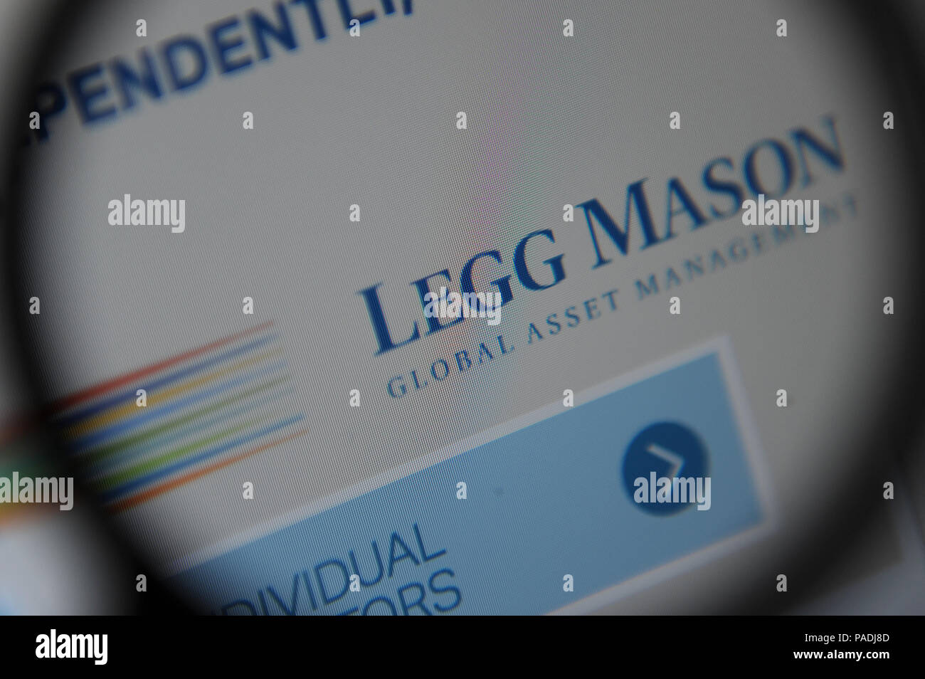 The Legg Mason website seen through a magnifying glass Stock Photo - Alamy