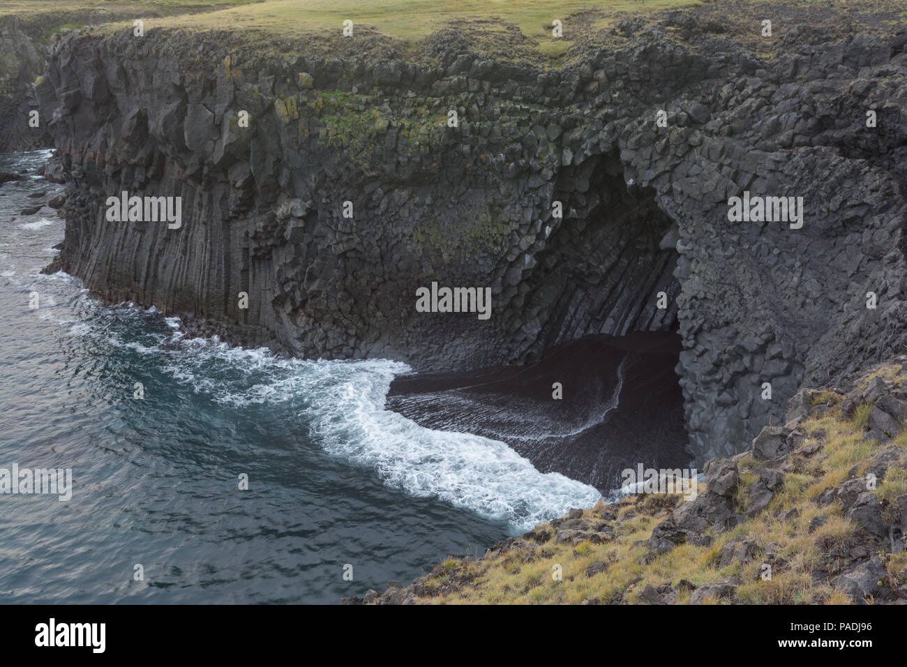 Waves of the ocean breaking on the cliffs of Iceland Stock Photo - Alamy