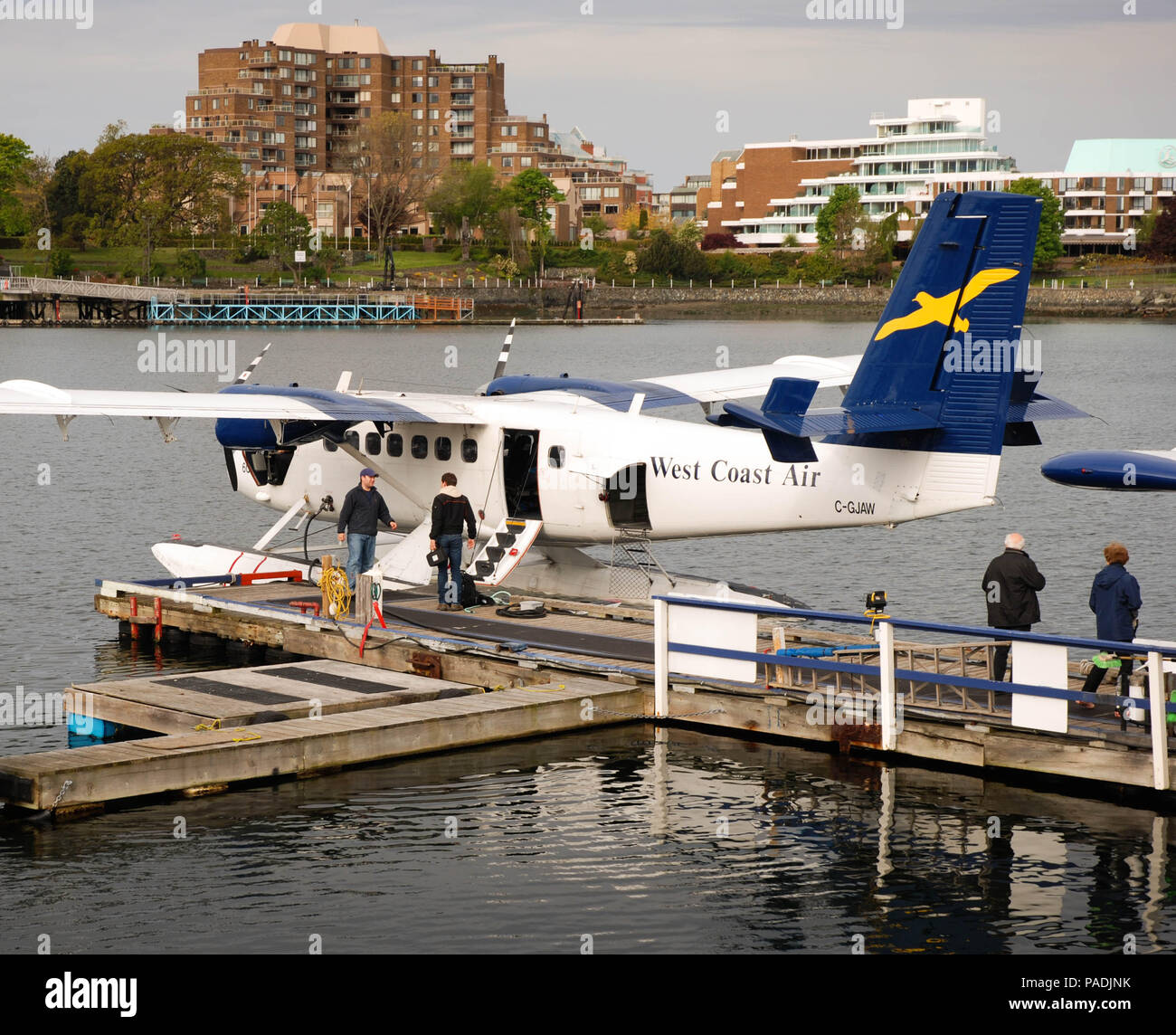 A West Coast Air Twin Otter float plane tied up alongside the jetty at ...