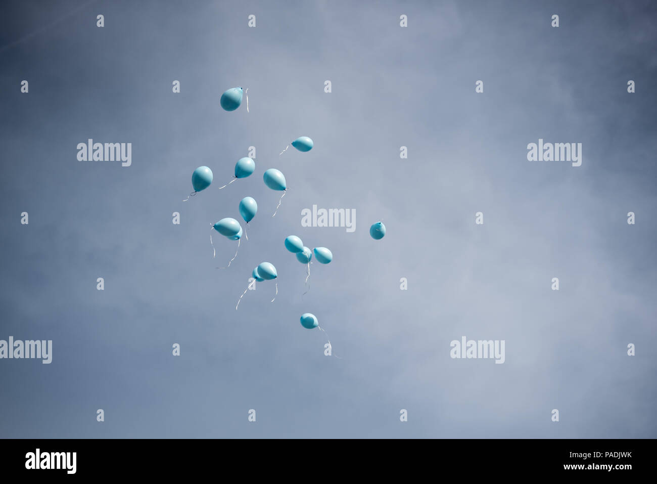 blue balloons flying to the sky Stock Photo - Alamy