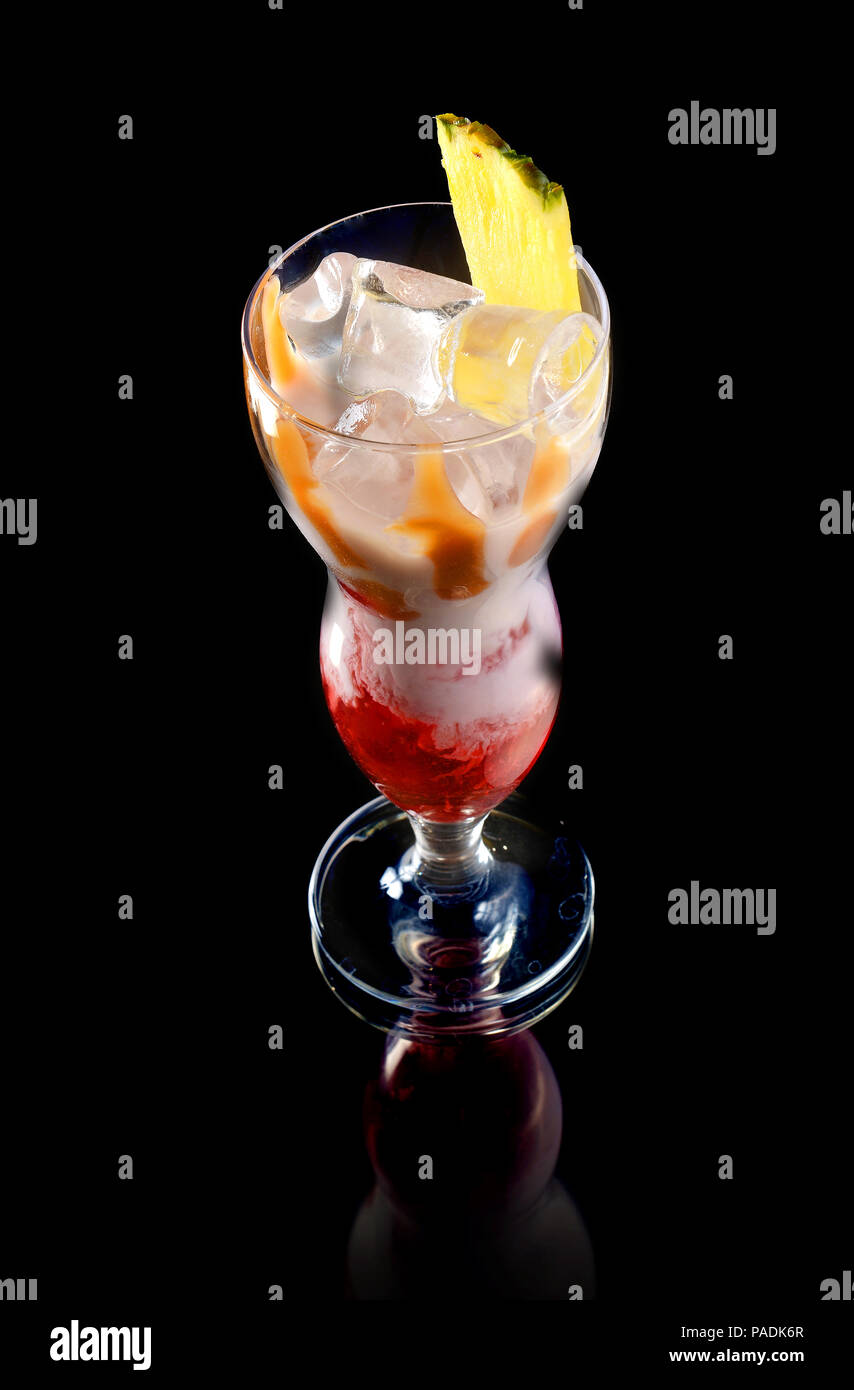 cocktail with juice and cream on a black background Stock Photo - Alamy