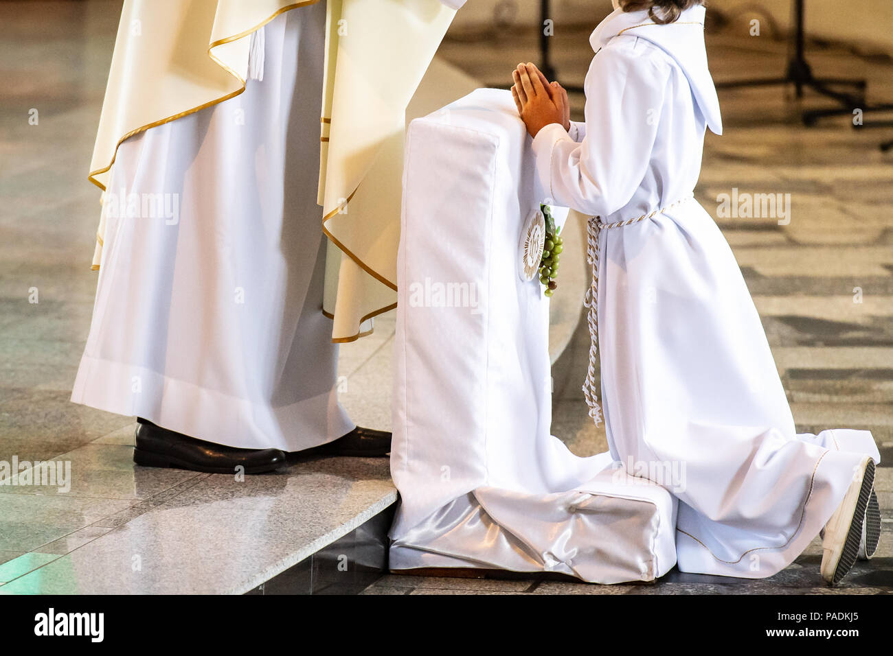 boy accepting first holy communion Stock Photo - Alamy