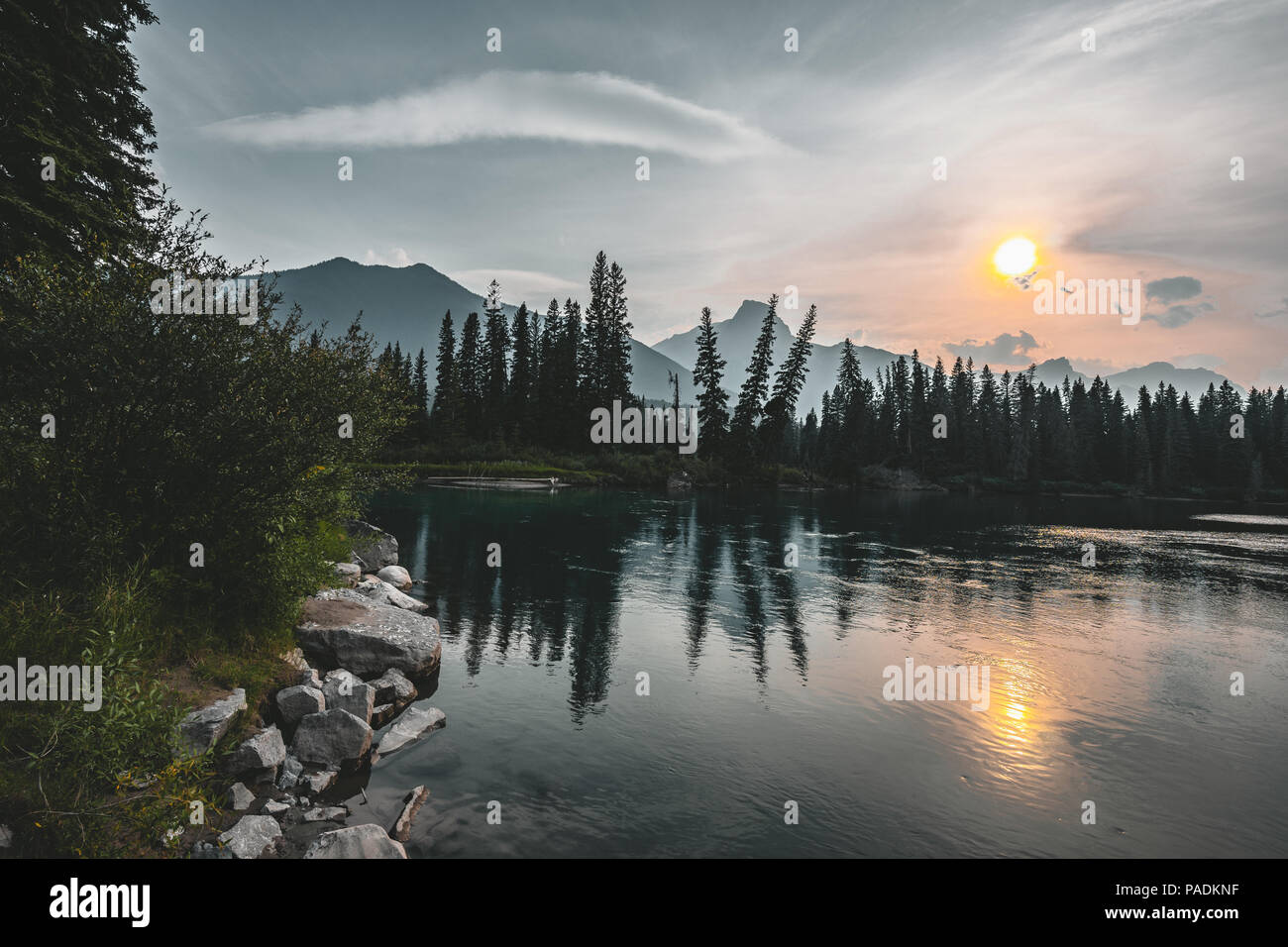 Scenic sunset views over bow river three sisters, Banff National Park ...