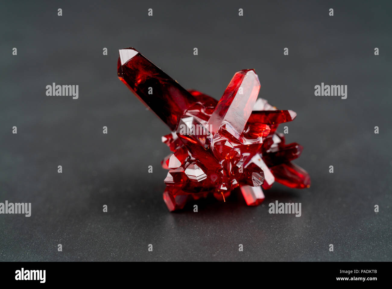 red crystal of natural origin. close up of crystals in ruby color on ...