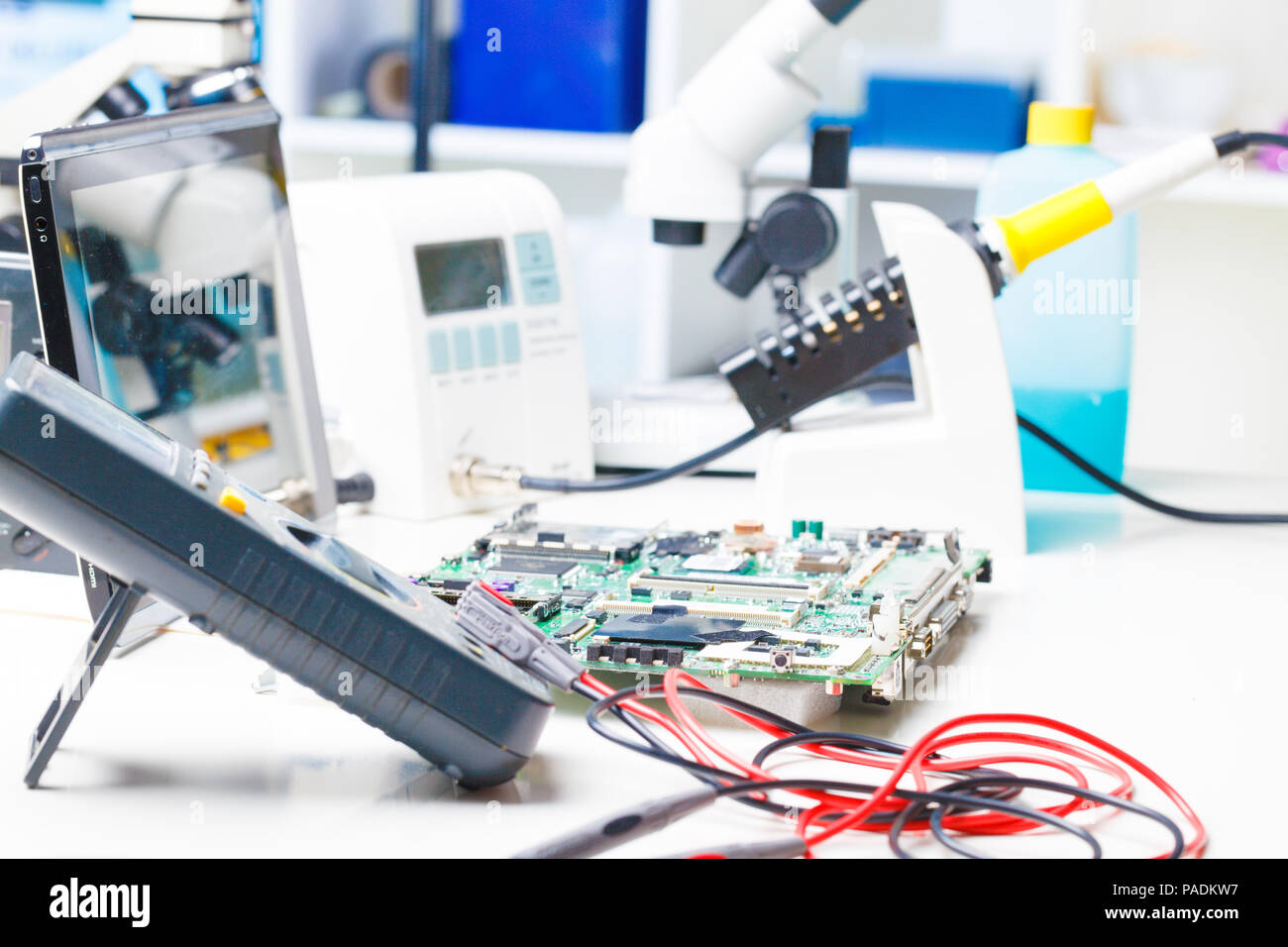 hand men hold tool repairs electronics manufacturing Stock Photo - Alamy