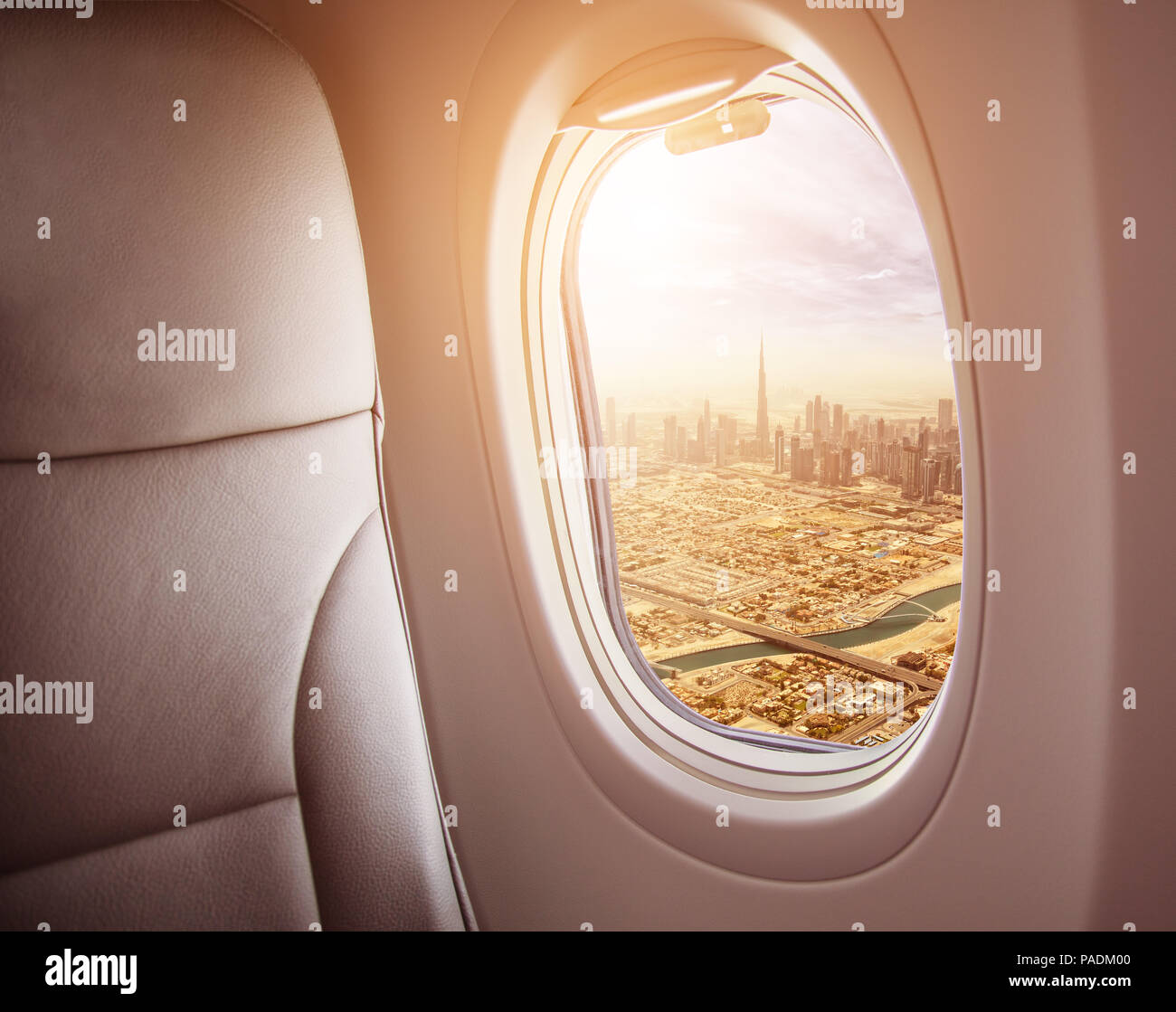 Airplane interior with window view of Dubai city, UAE. Concept of ...
