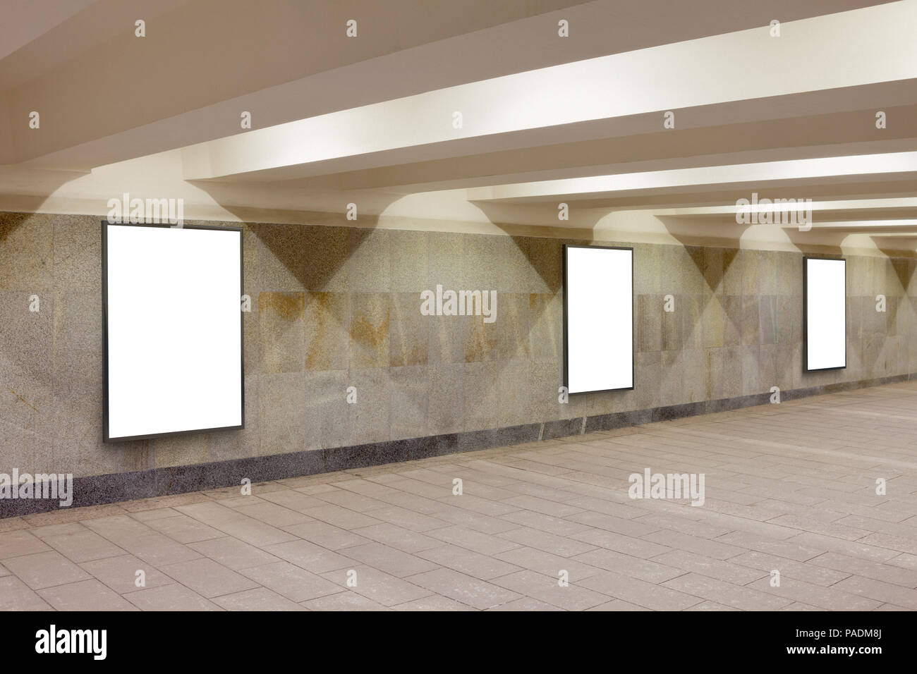 Three blank billboard advertisement posters on underground wall Stock ...