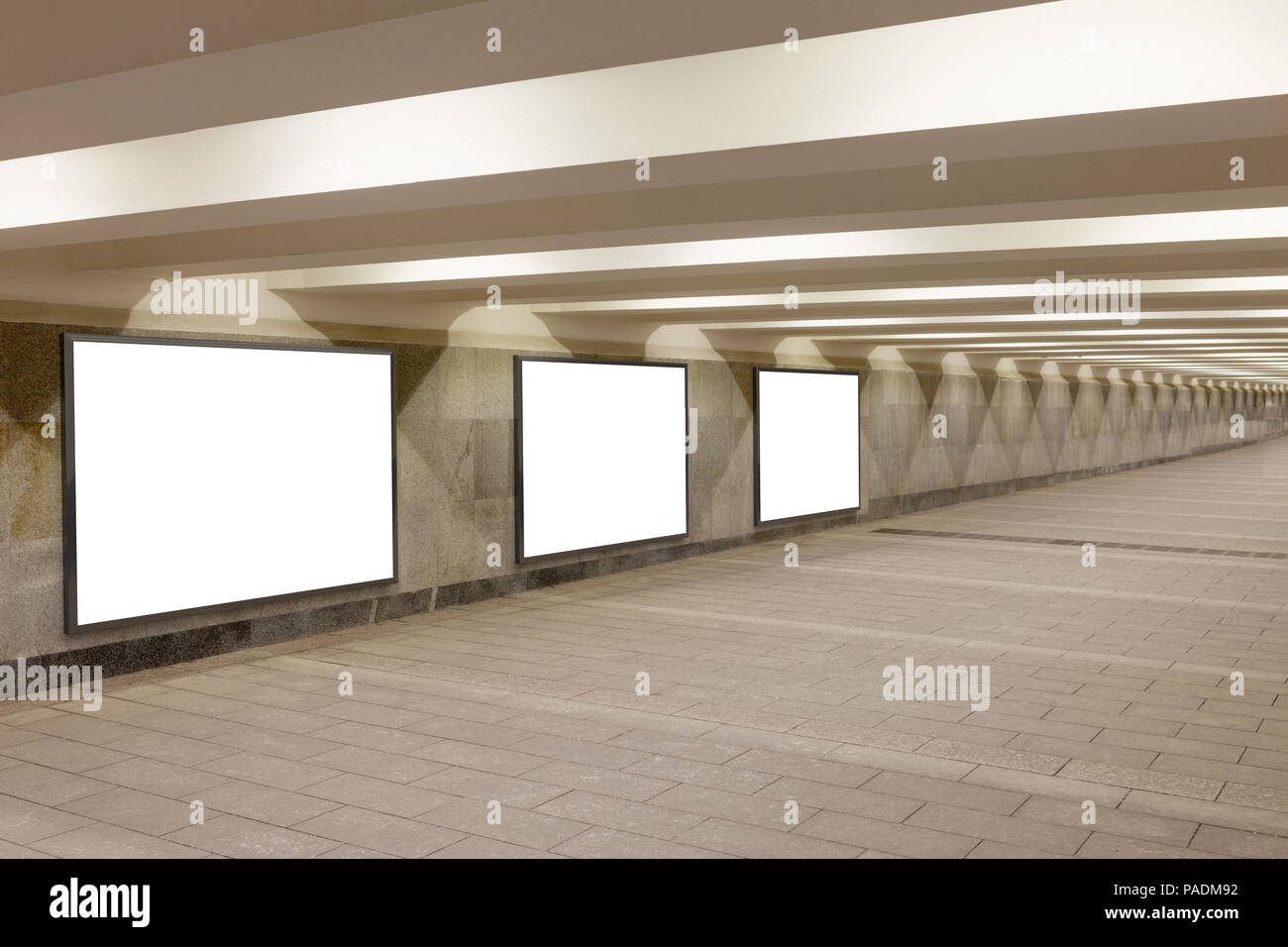 Three blank billboard advertisement posters on underground wall Stock ...
