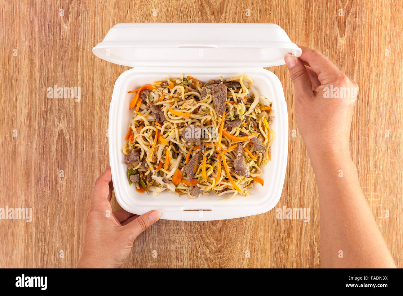 Delicious noodles in take away box from above Stock Photo - Alamy
