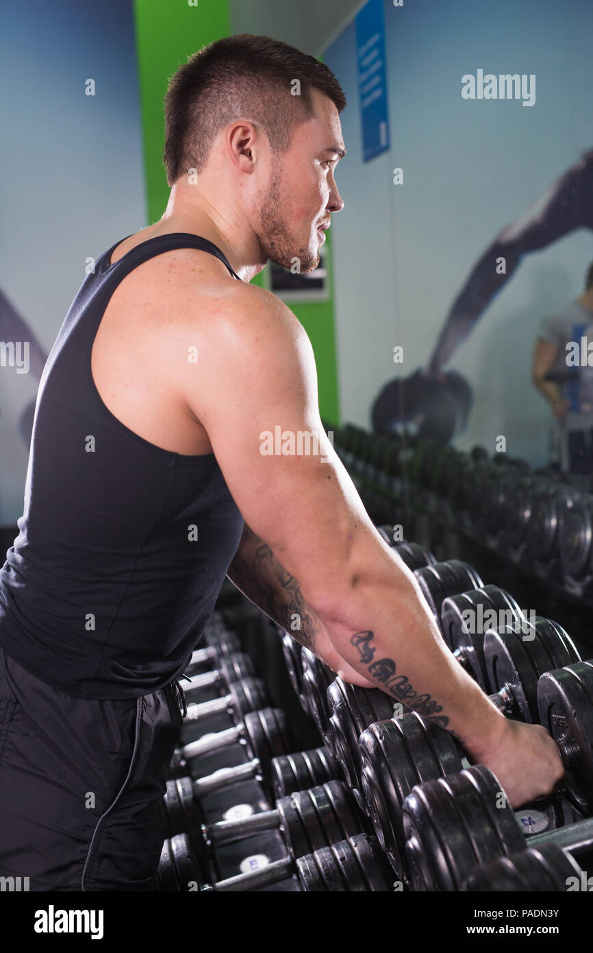 Athlete takes dumbbell training hi-res stock photography and images - Alamy
