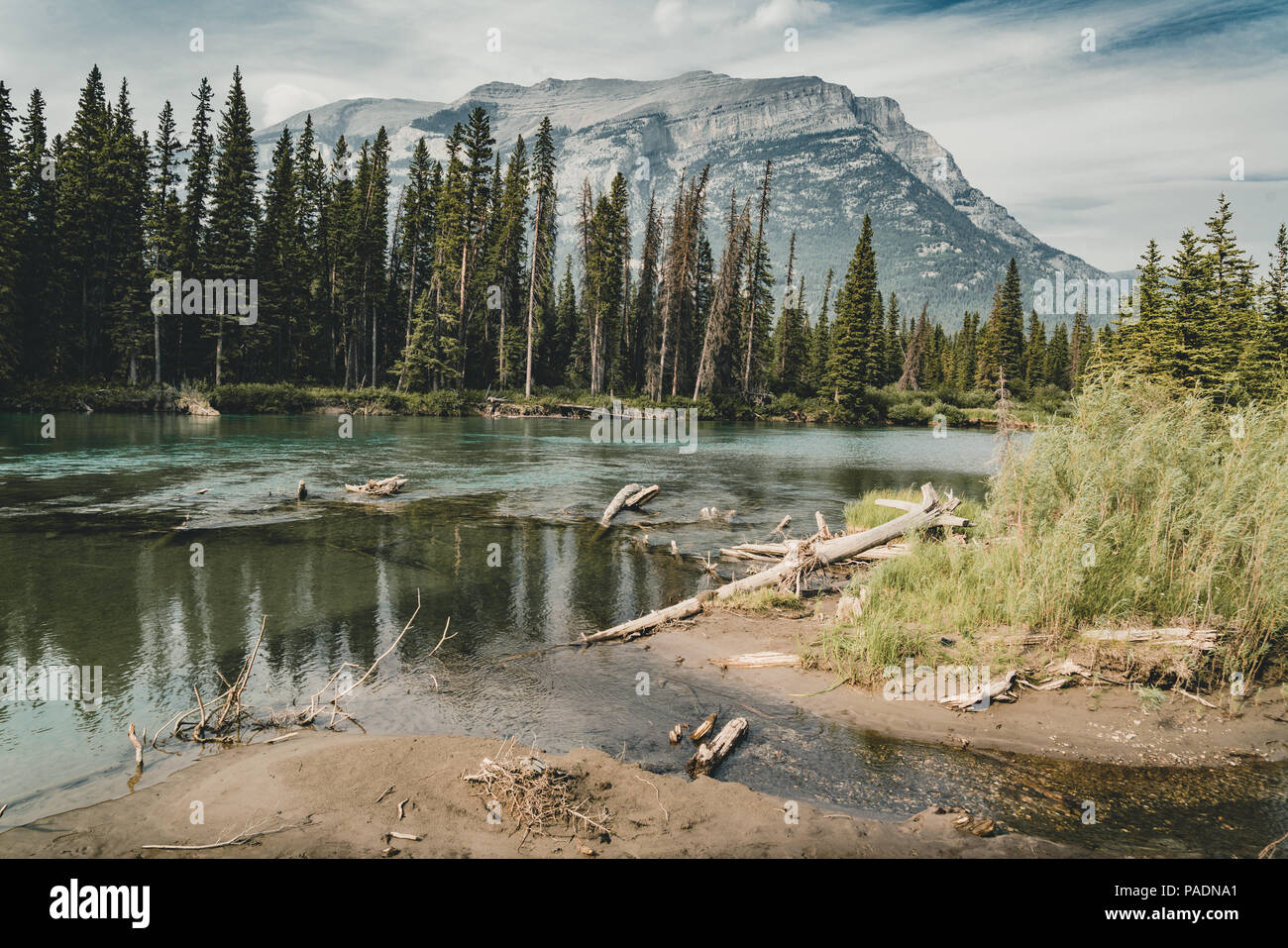 Scenic sunset views over bow river three sisters, Banff National Park ...