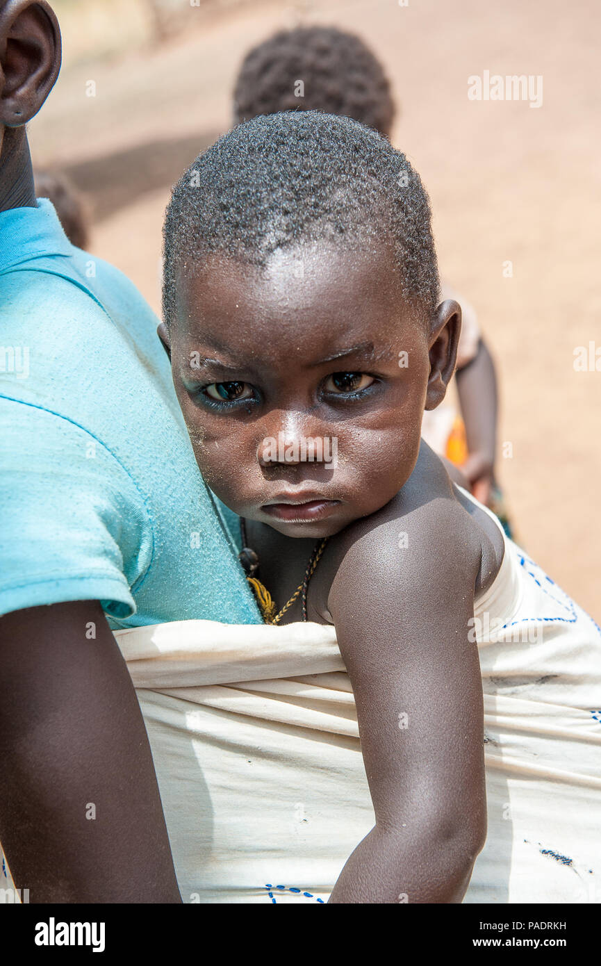 ACCRA, GHANA - MARCH 6, 2012: Unidentified Ghanaian boy on his brothers ...