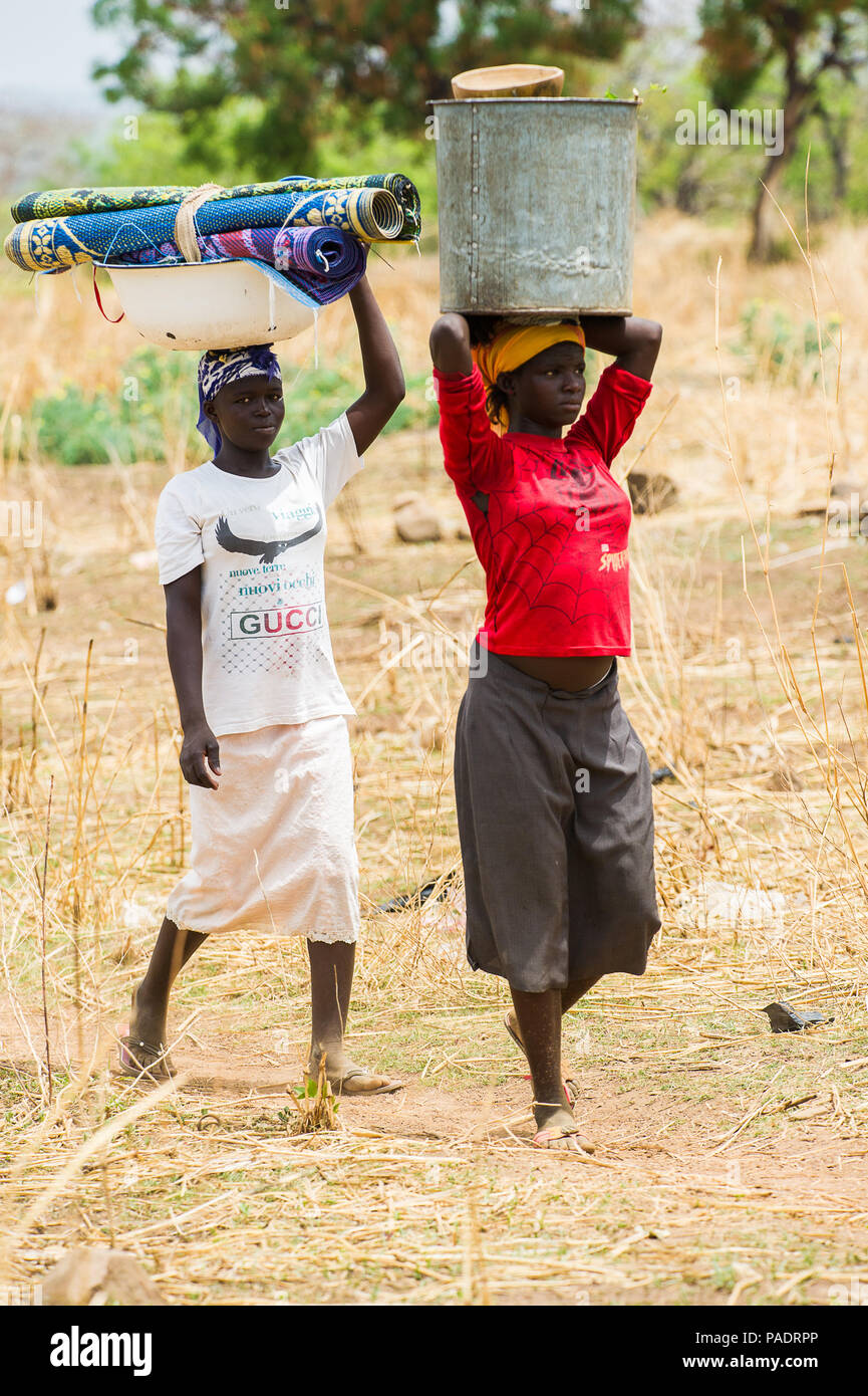 ACCRA, GHANA - MARCH 6, 2012: Unidentified Ghanaian women carry carpet ...