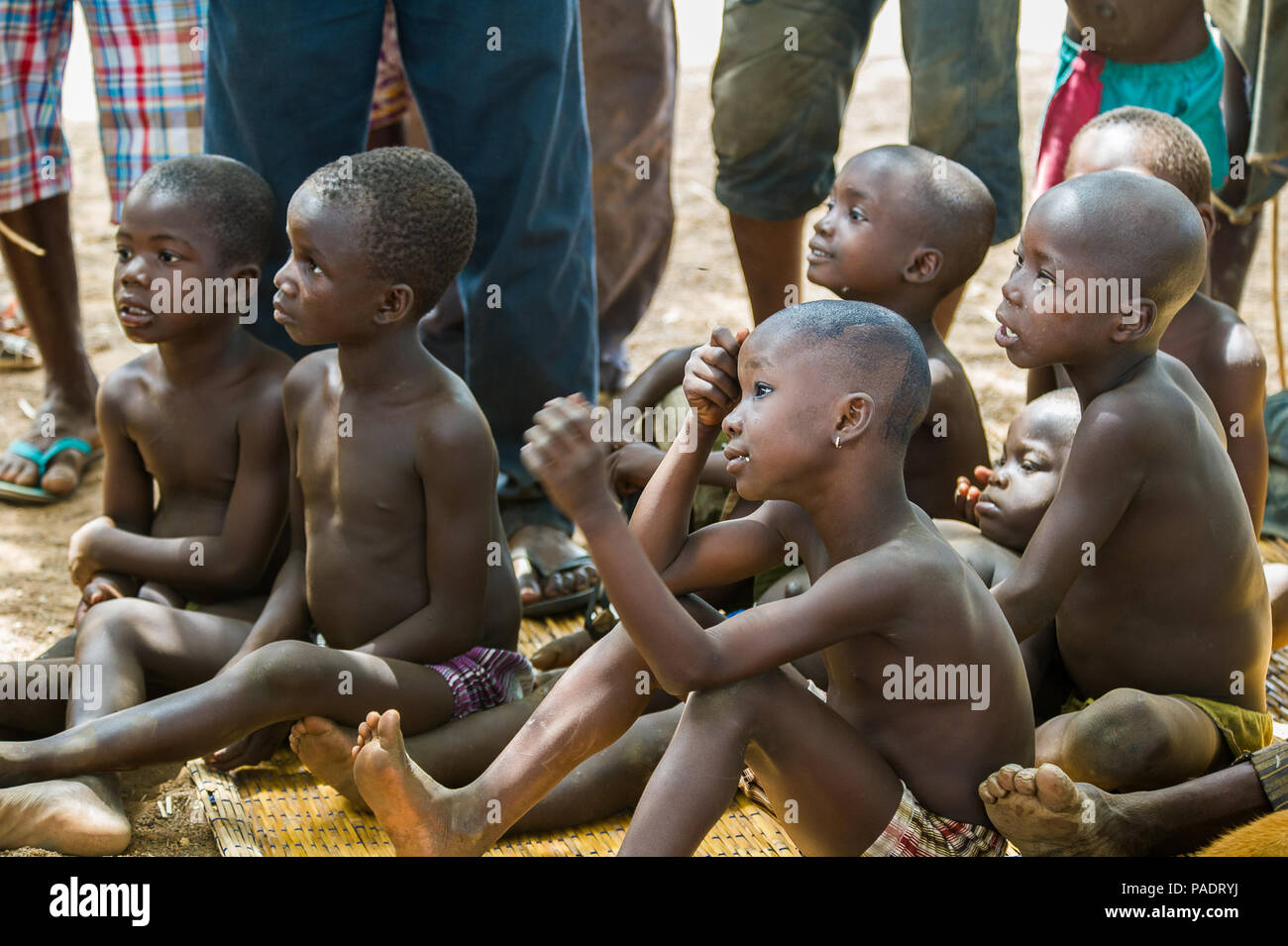 ACCRA, GHANA - MARCH 6, 2012: Unidentified Ghanaian children listen to ...