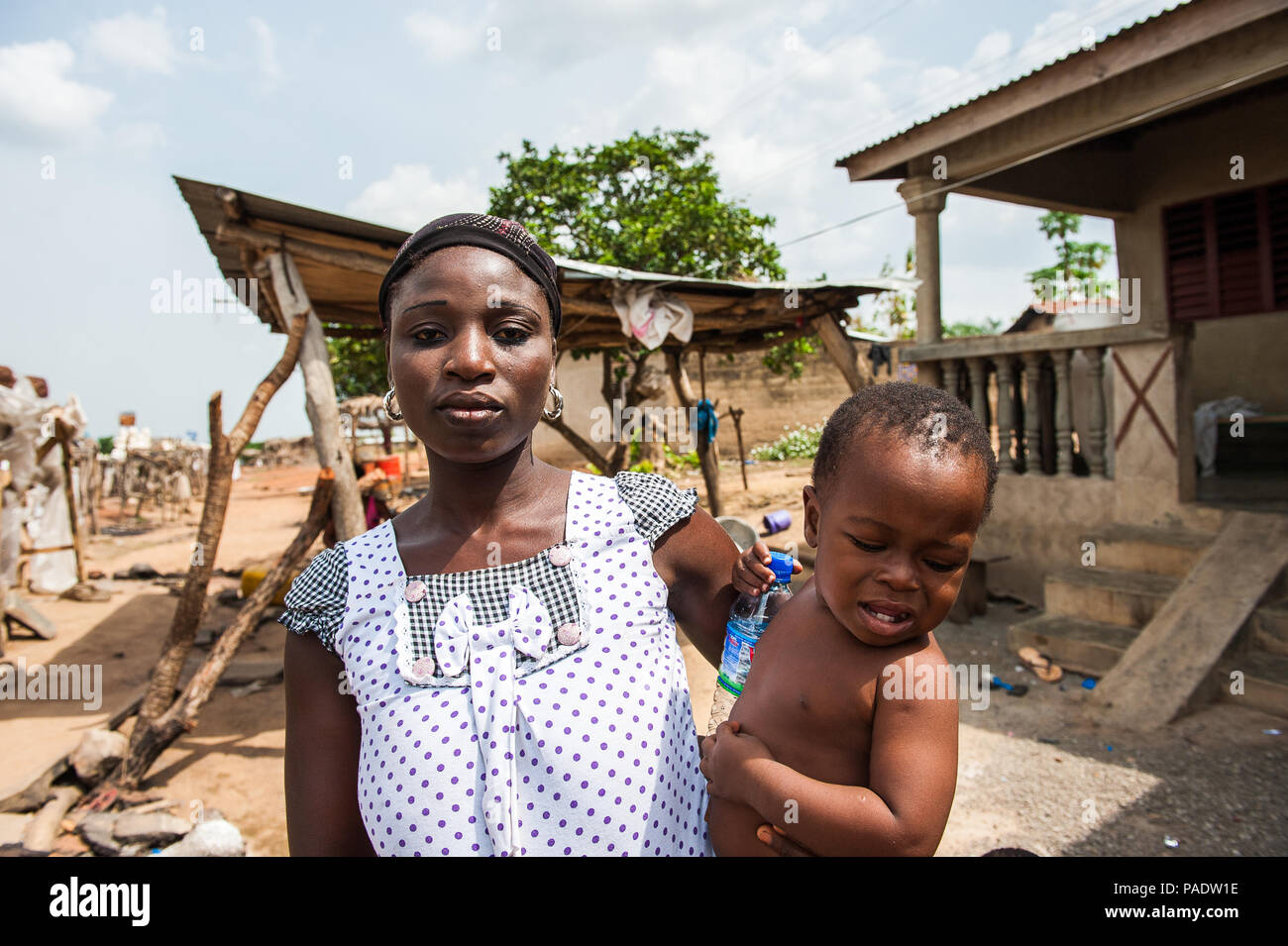 PORTO-NOVO, BENIN - MAR 8, 2012: Unidentified Beninese mother carries ...