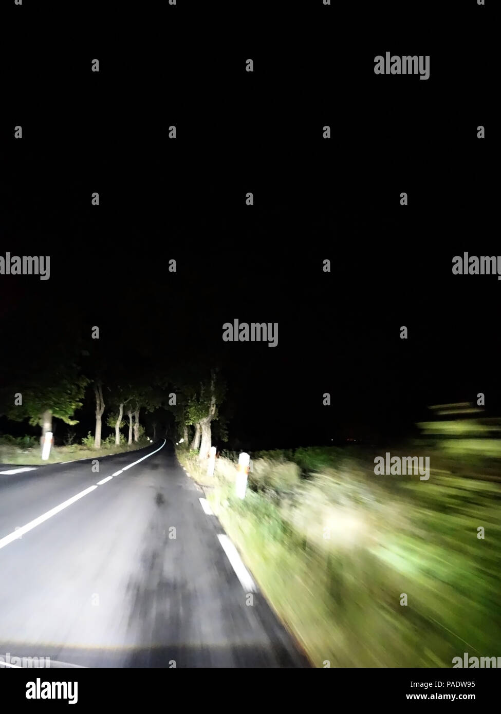 Car driving at night on a dark road hi-res stock photography and images ...