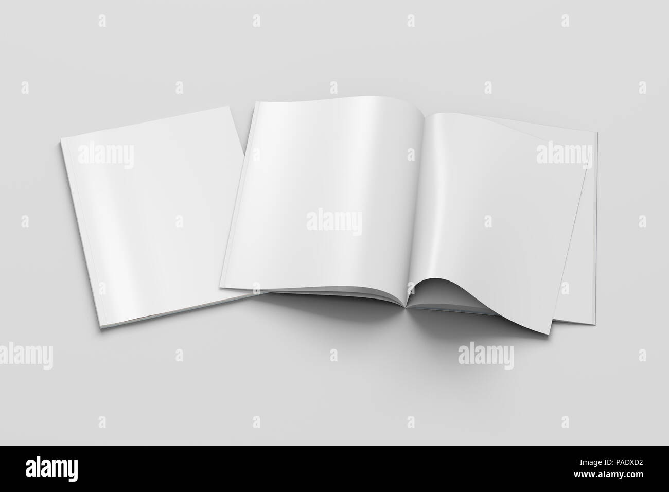 Blank magazine pages with bent glossy paper and blank cover on white ...
