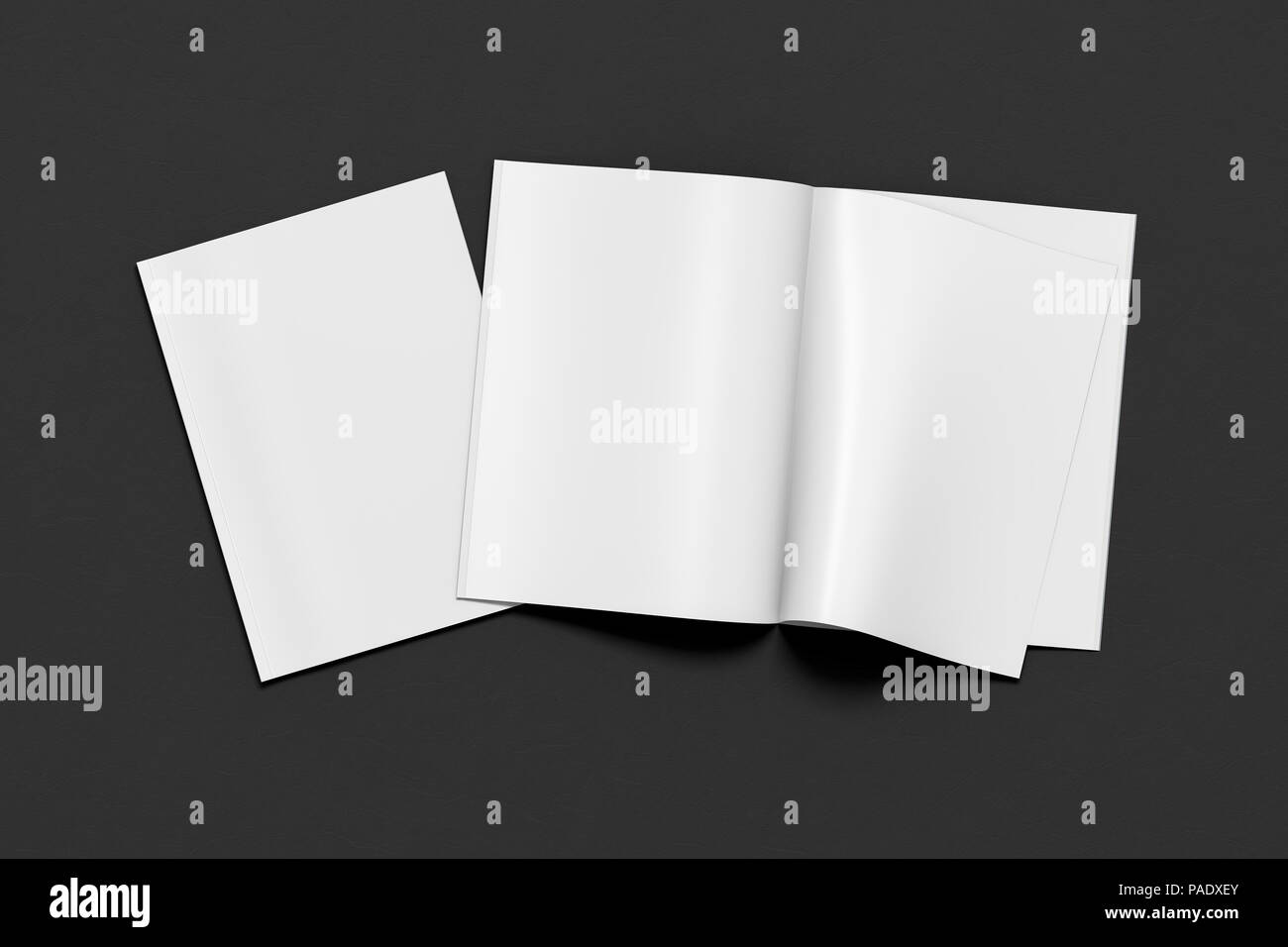 Blank magazine pages with bent glossy paper and blank cover on black ...