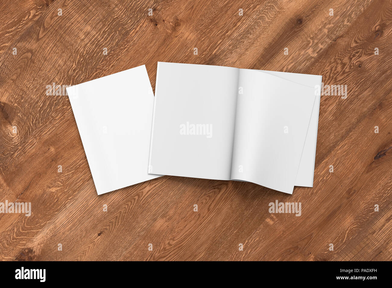 Blank magazine pages with bent glossy paper and blank cover on wooden ...