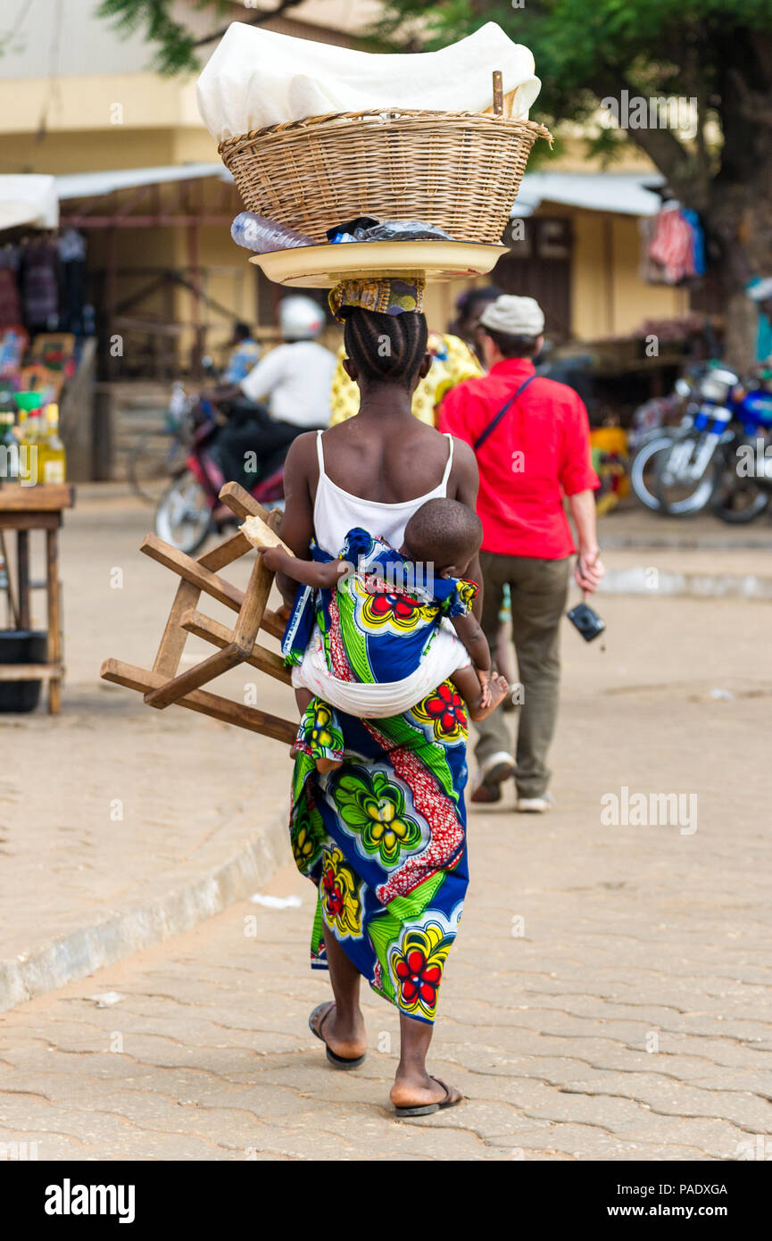 PORTO-NOVO, BENIN - MAR 10, 2012: Unidentified Beninese woman carries ...