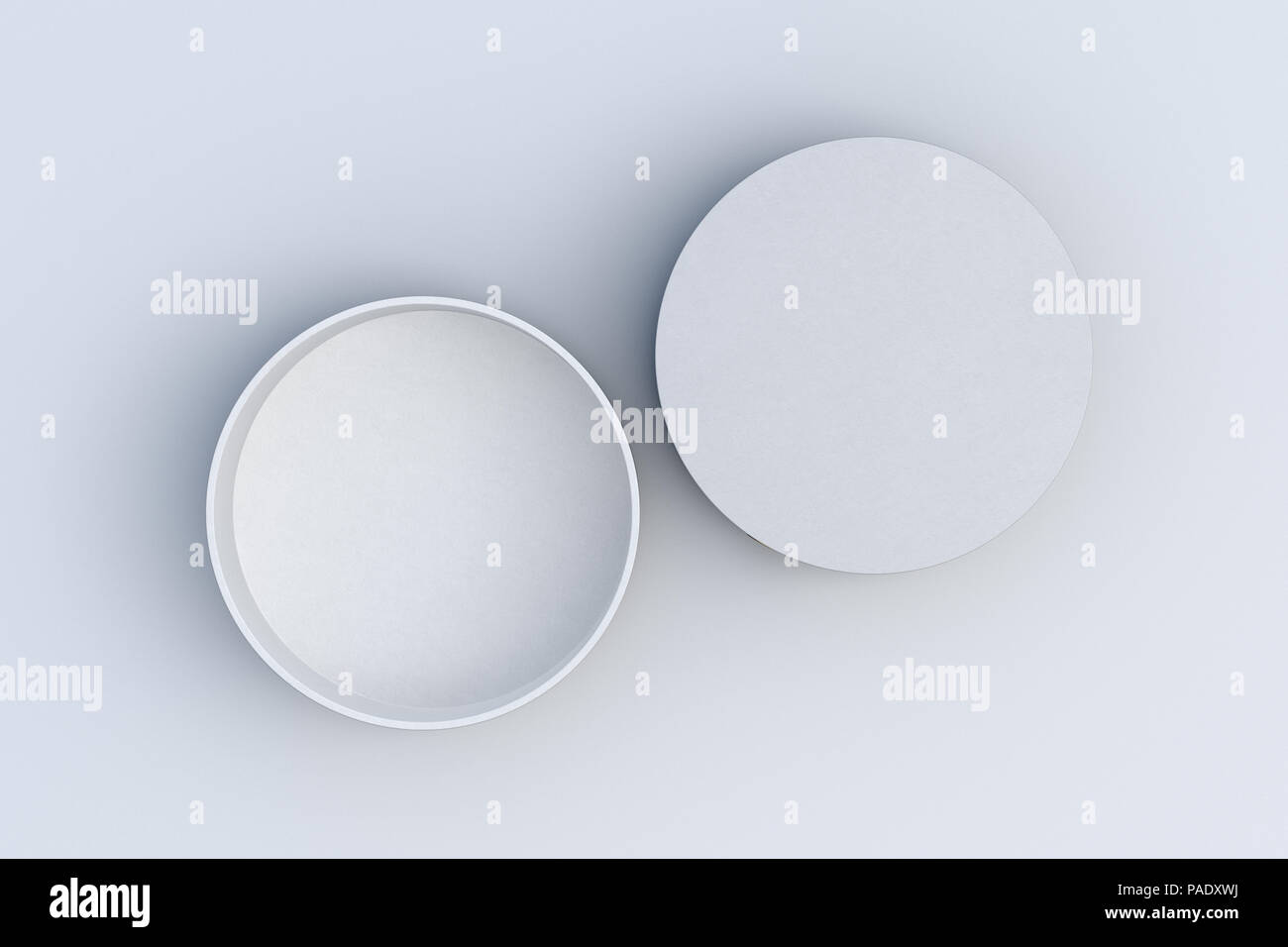 Two white round boxes opened and closed on white background. 3d ...
