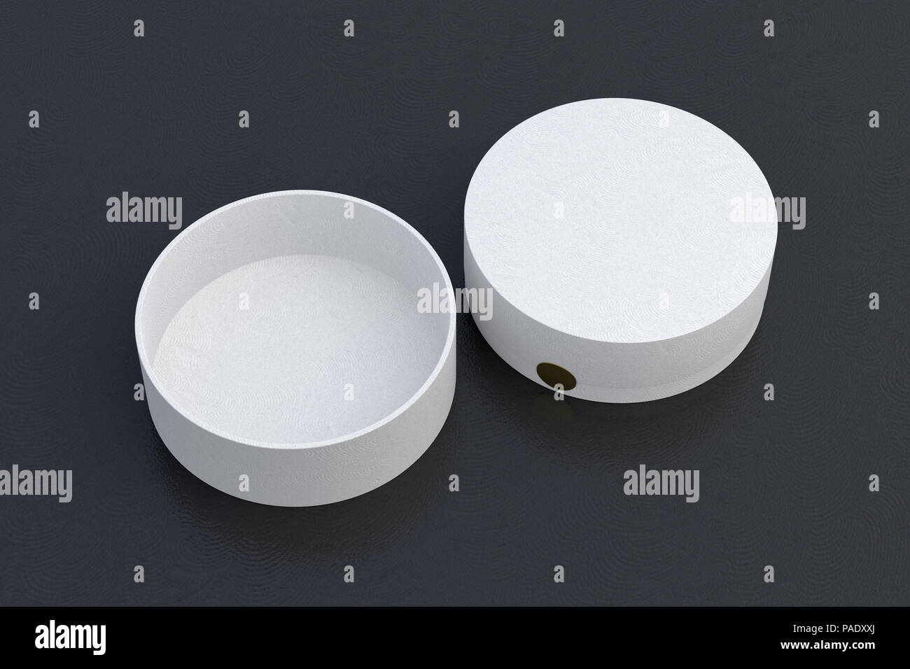 Two white round boxes opened and closed on black background. 3d ...
