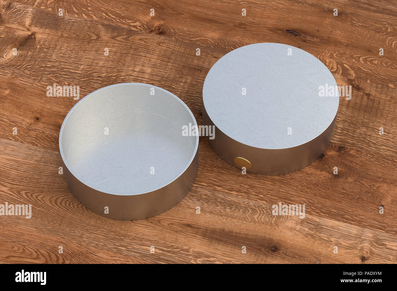 Two silver round boxes opened and closed on wood background. 3d ...