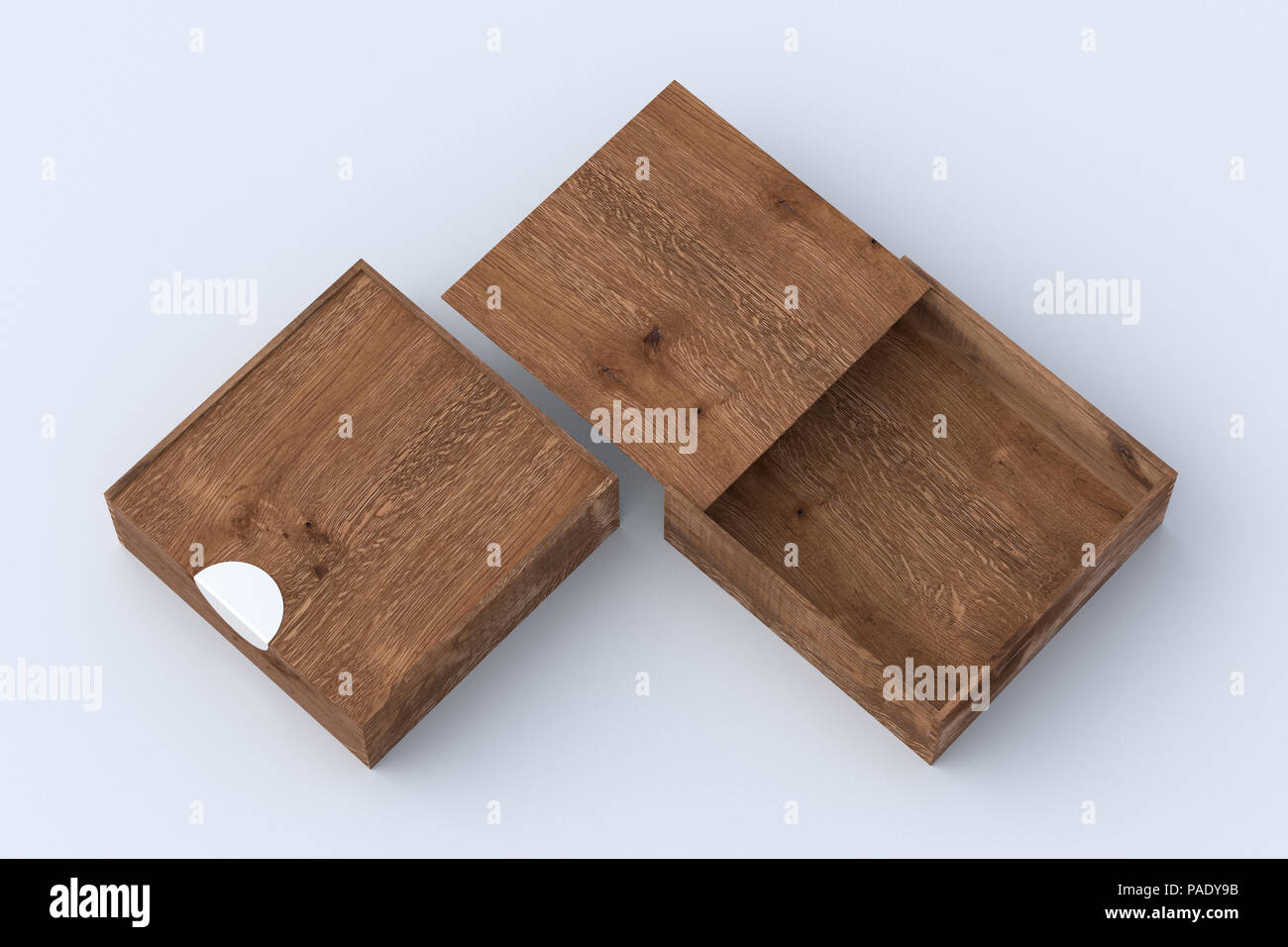 Two dark wooden square boxes with sliding lid on white background ...