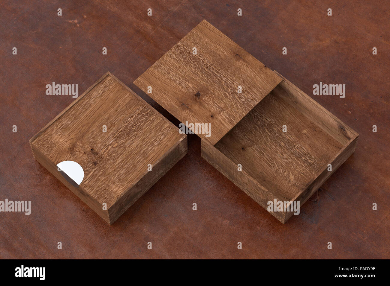 Two dark wooden square boxes with sliding lid on brown leather ...