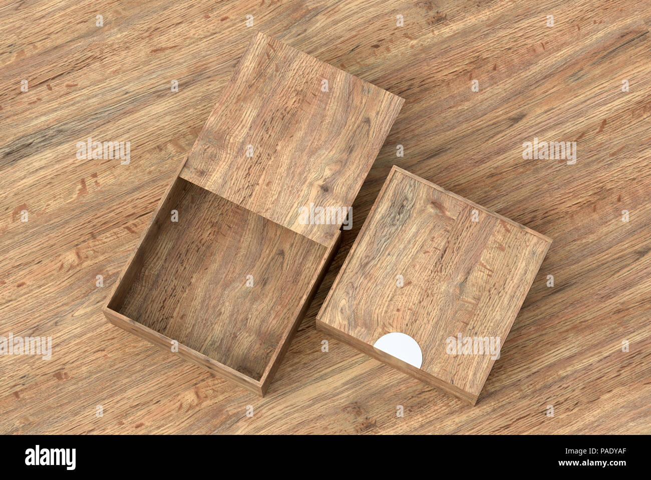 Two wooden square boxes with sliding lid on wooden background. Empty ...