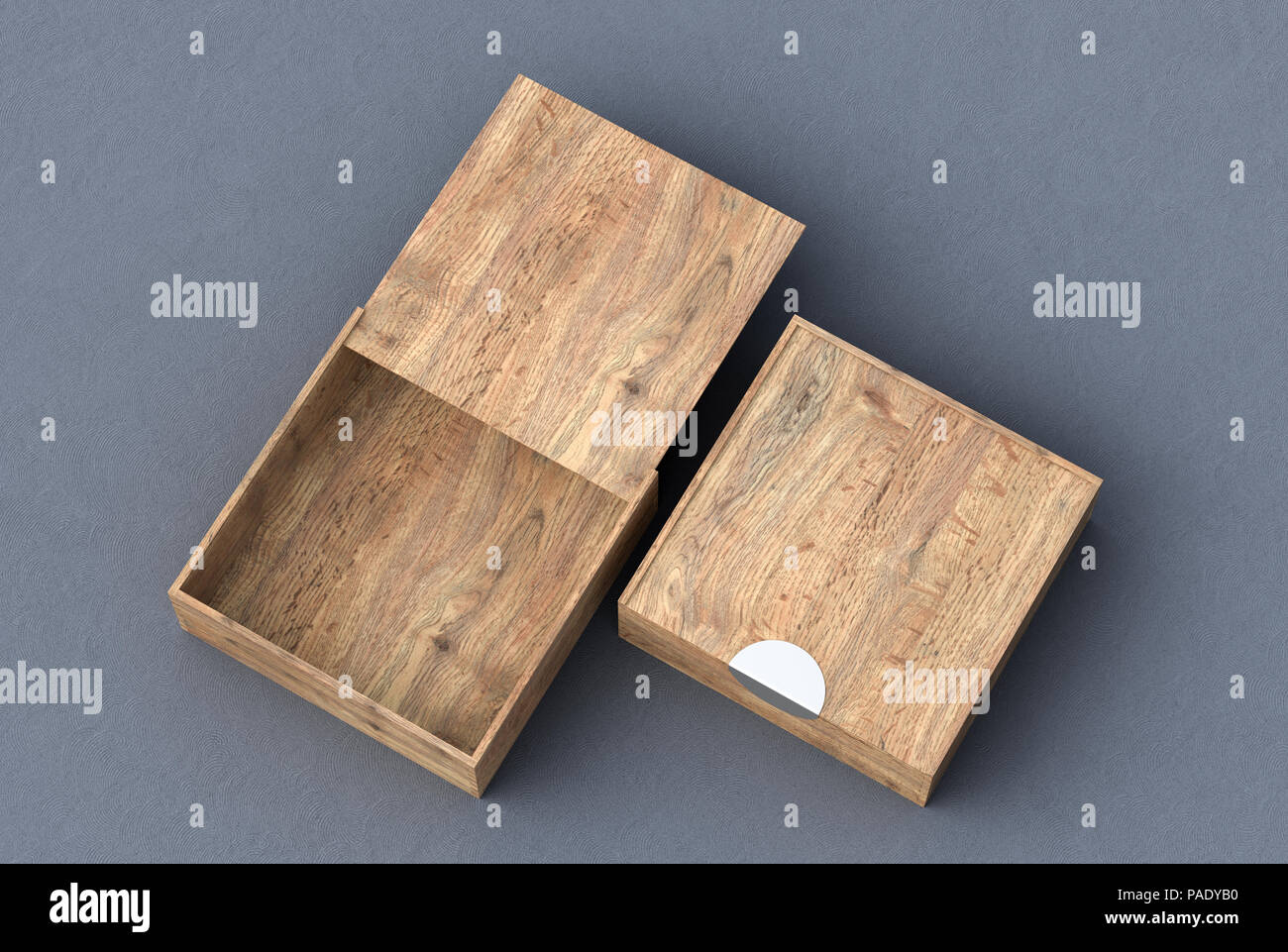 Two wooden square boxes with sliding lid on gray background. Empty ...