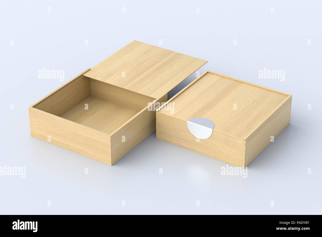 Two light wooden square boxes with sliding lid on white background ...