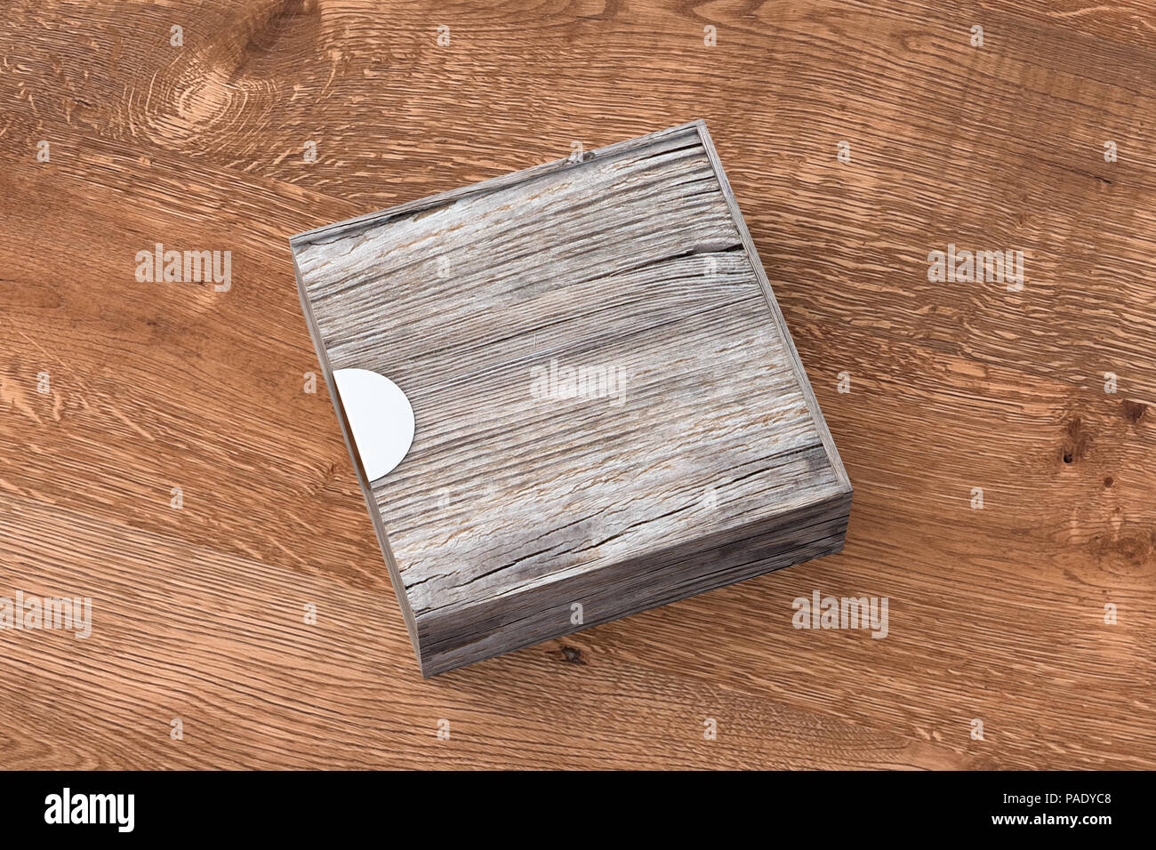 Blank vintage wooden square box with closed sliding lid on dark wooden ...