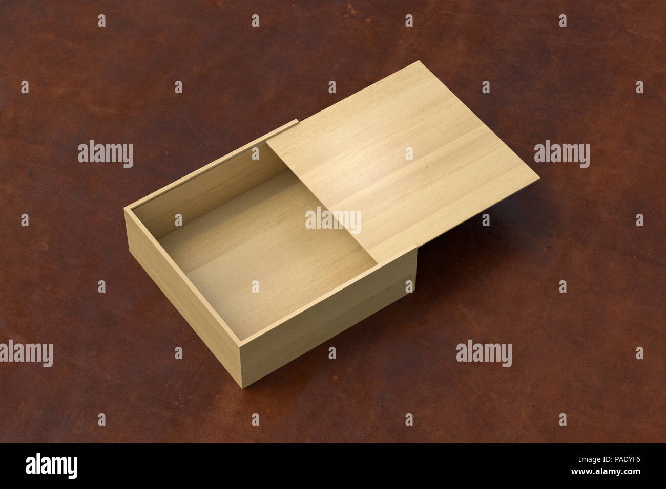 Empty light wooden square box with opened sliding lid on brown leather ...
