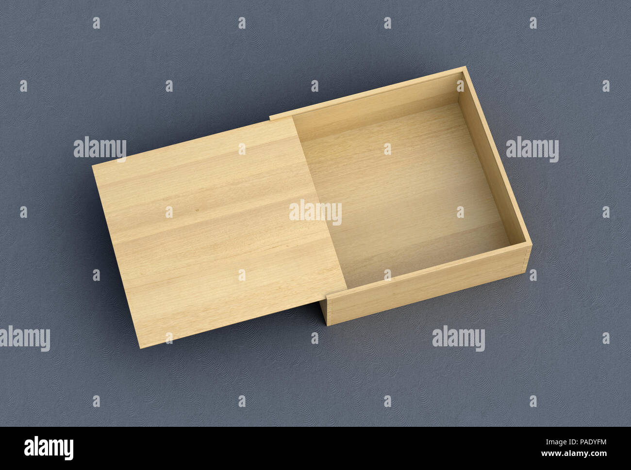 Empty light wooden square box with opened sliding lid on gray ...