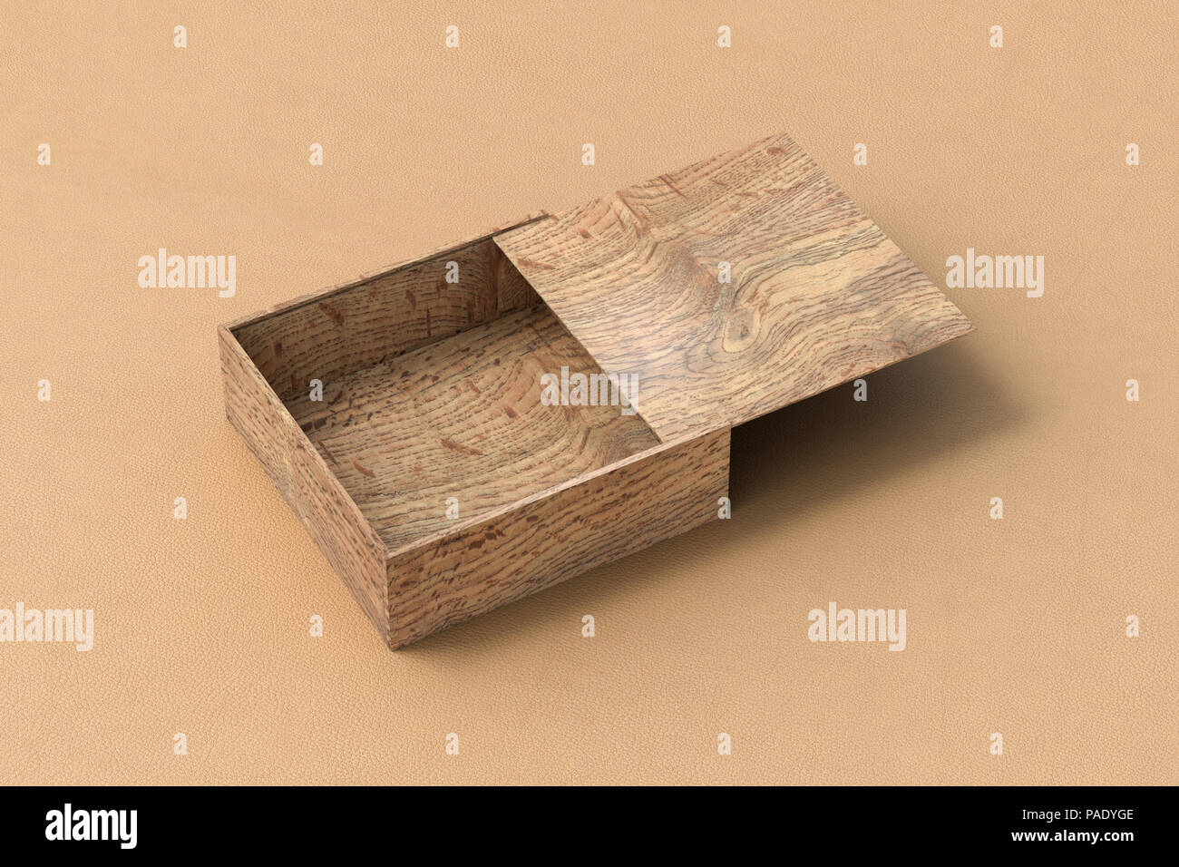 Empty wooden square box with opened sliding lid on beige leather ...