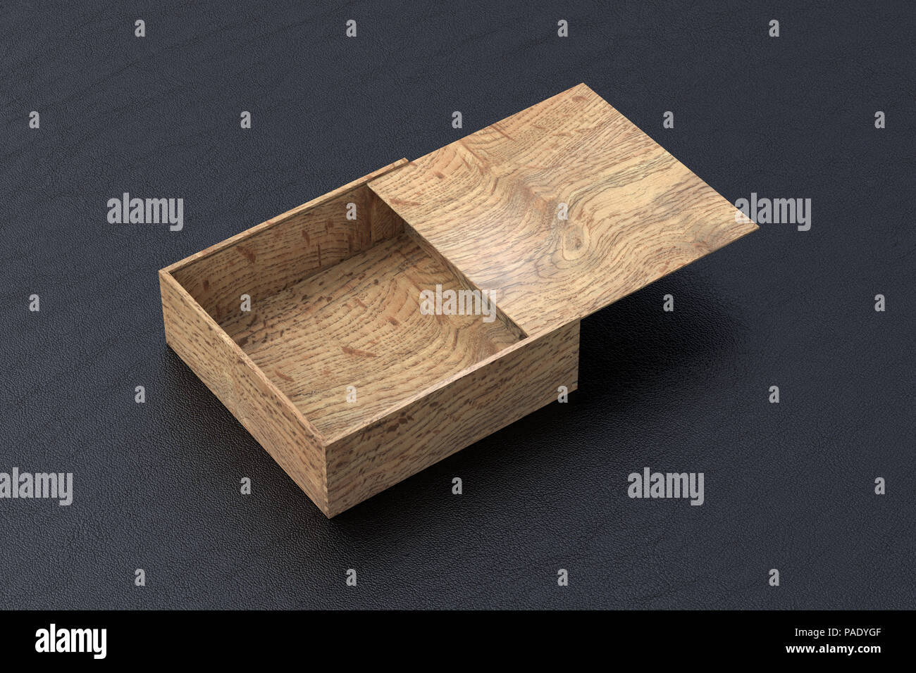 Empty wooden square box with opened sliding lid on black leather ...