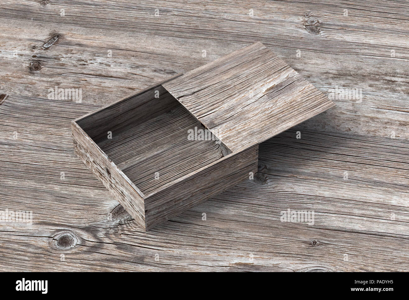 Empty vintage wooden square box with opened sliding lid on old wooden ...