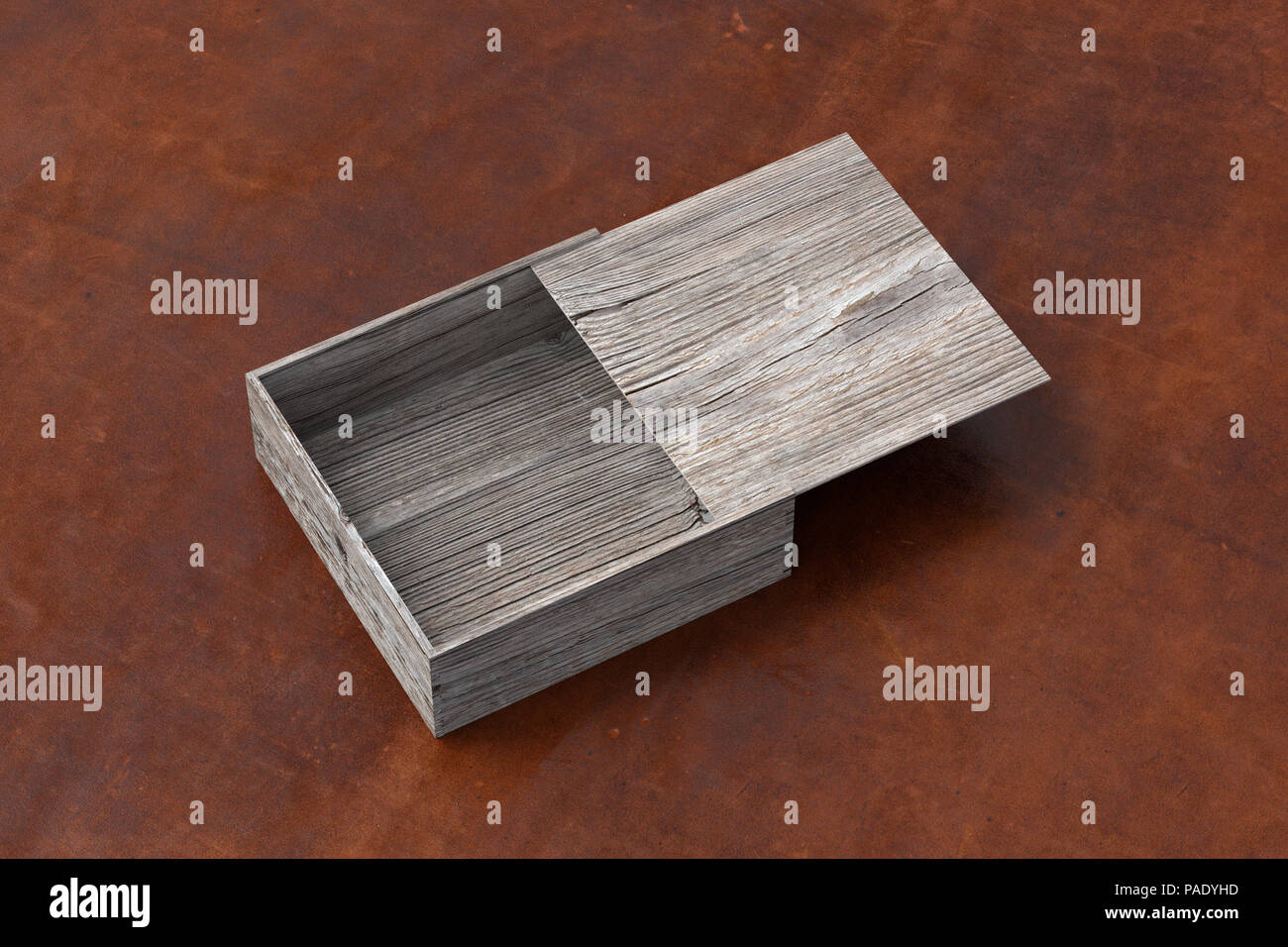 Empty square vintage wooden box with opened sliding lid on brown ...