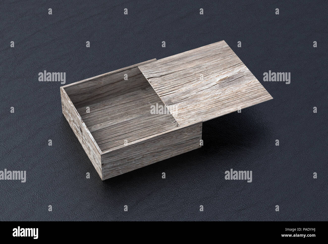 Empty square vintage wooden box with opened sliding lid on black ...